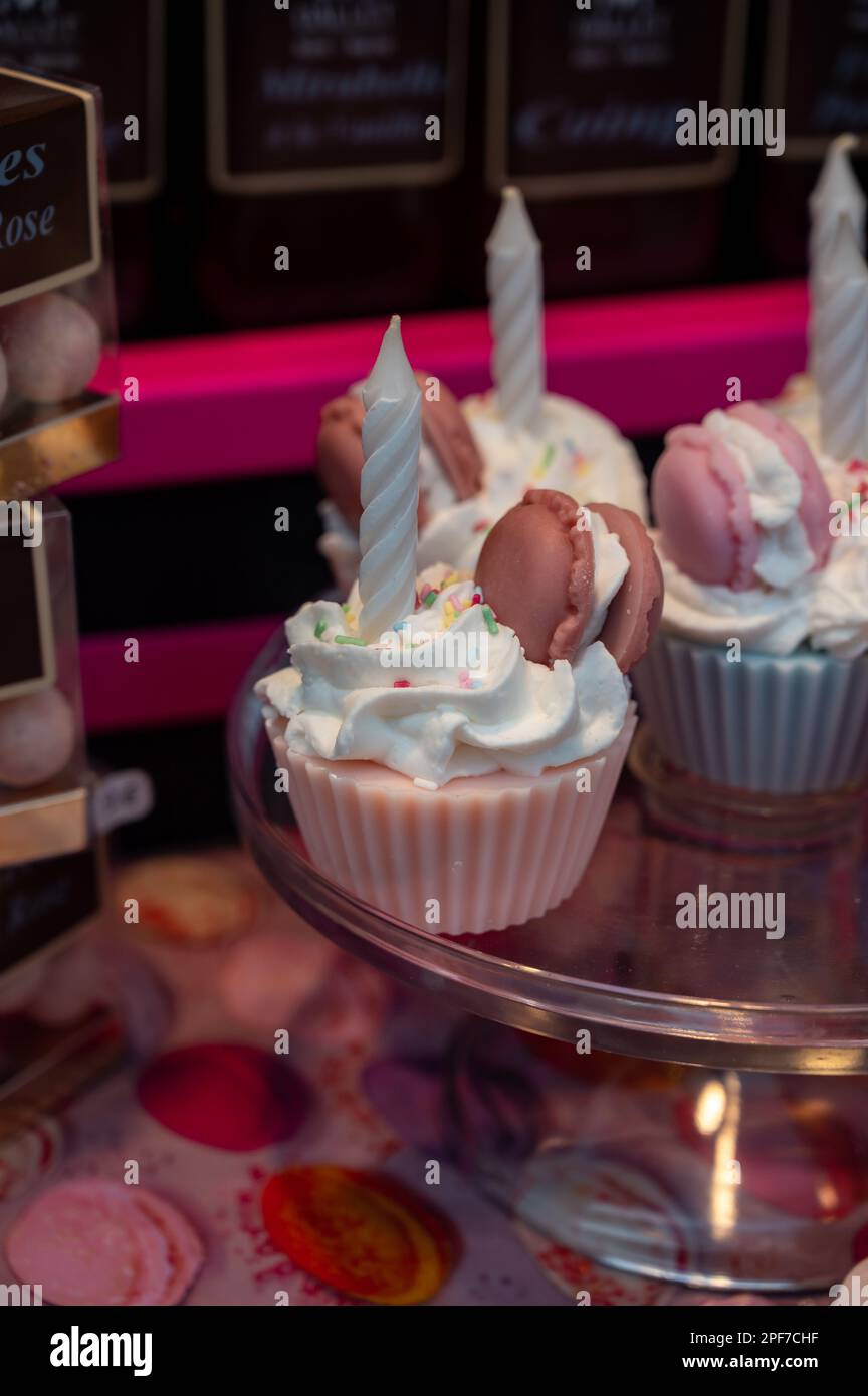 Assortment of french fresh baked sweet pastry, rose cupcakes with ...