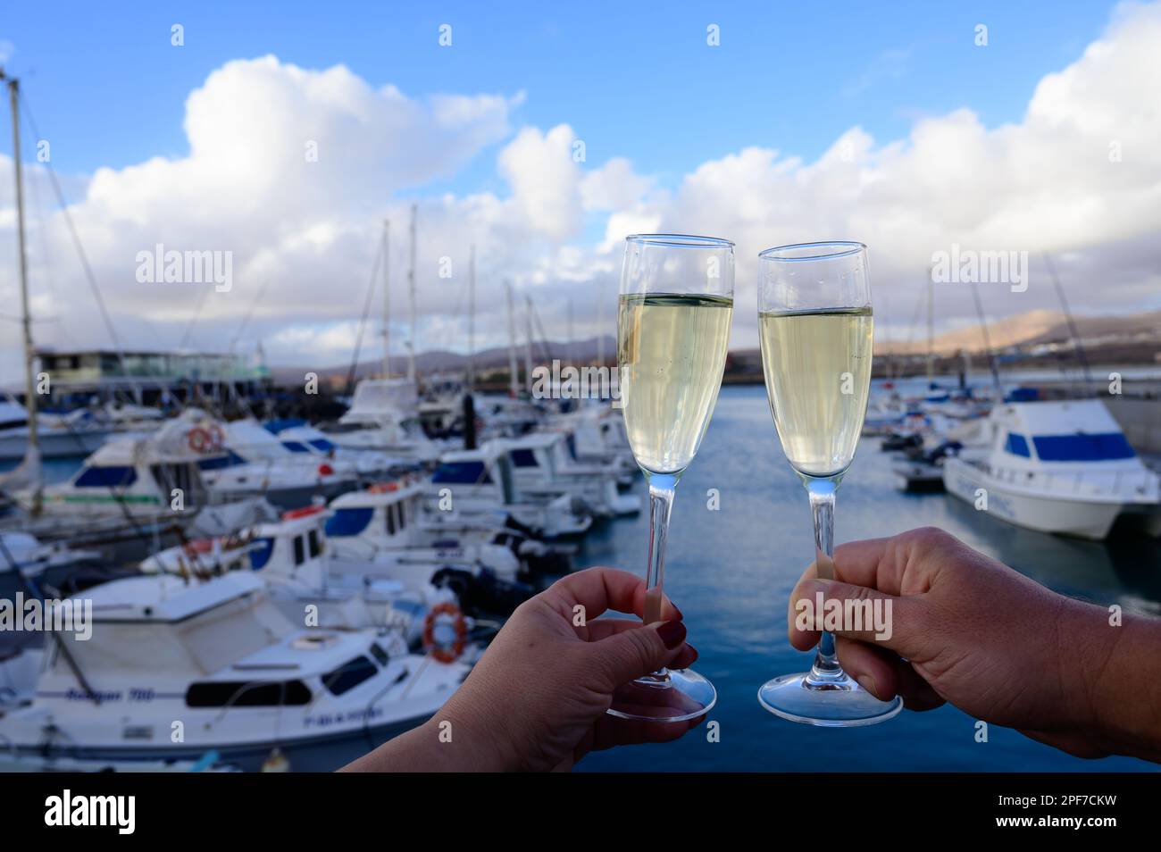 Everyday party, hands with glasses of cava or champagne sparkling wine ...