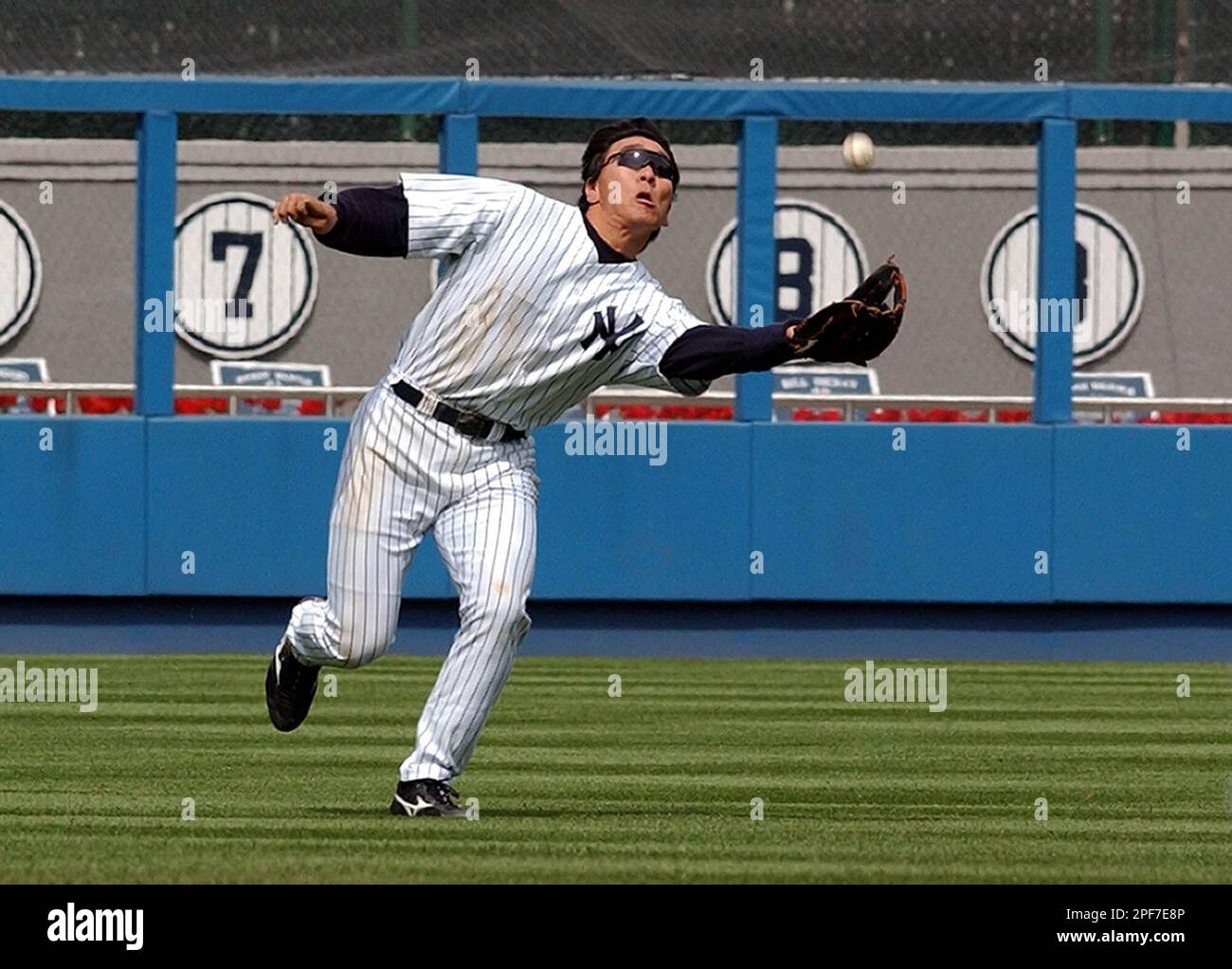 New York Yankees' Hideki Matsui reaches for a catch in the fifth inning ...