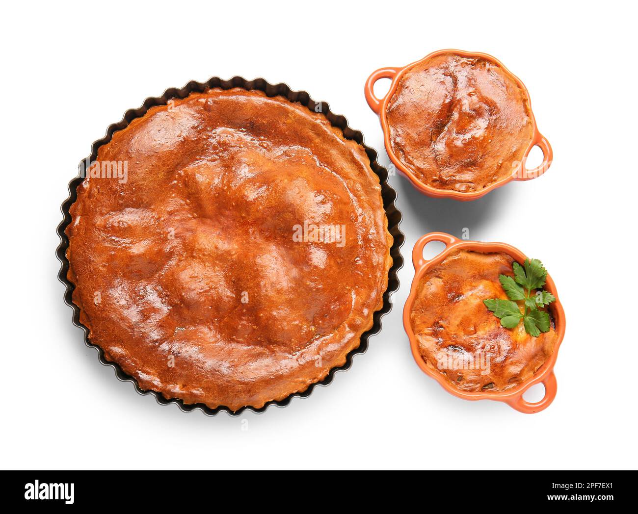 Delicious meat pies in baking forms isolated on white background Stock ...