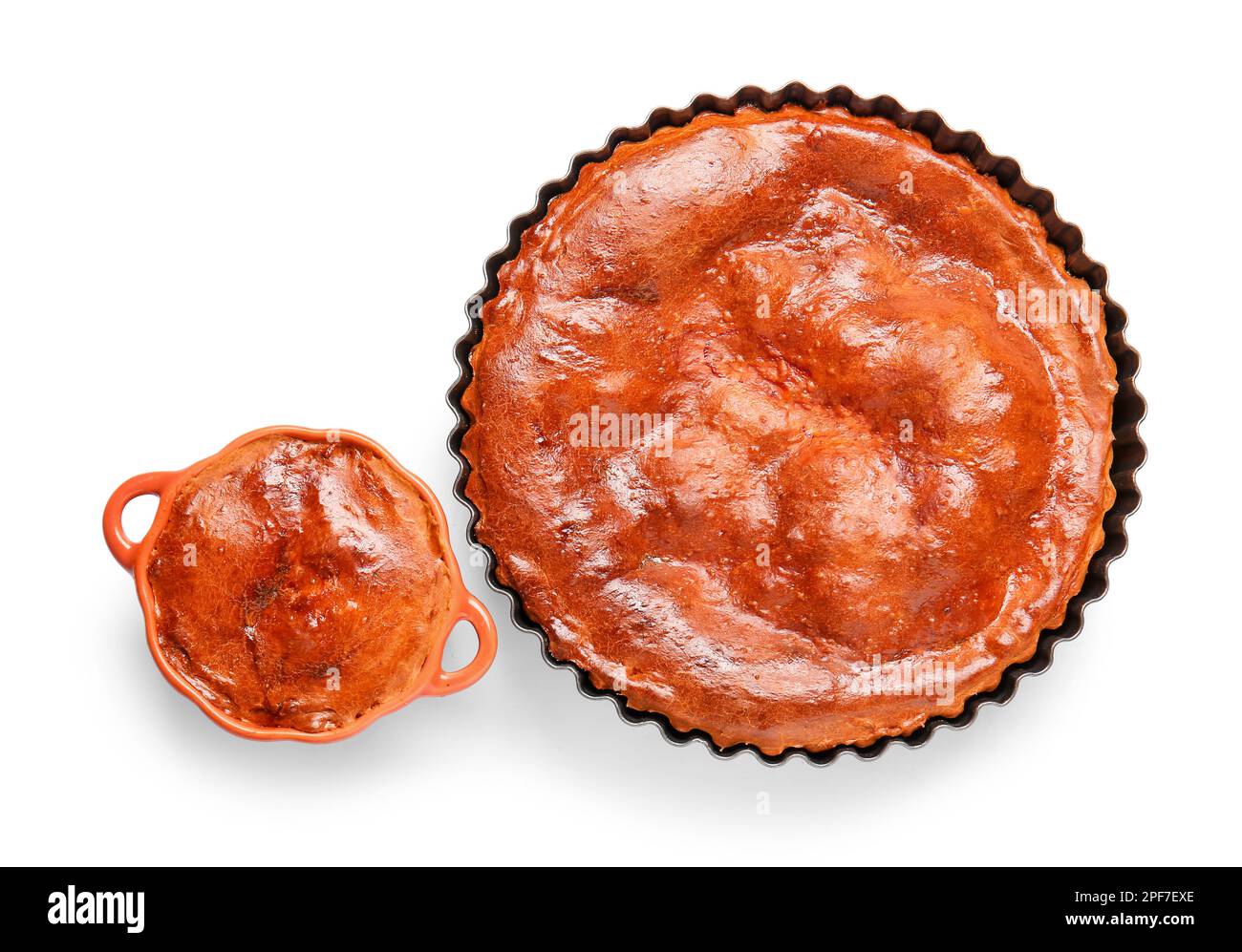 Delicious meat pies in baking forms isolated on white background Stock Photo - Alamy