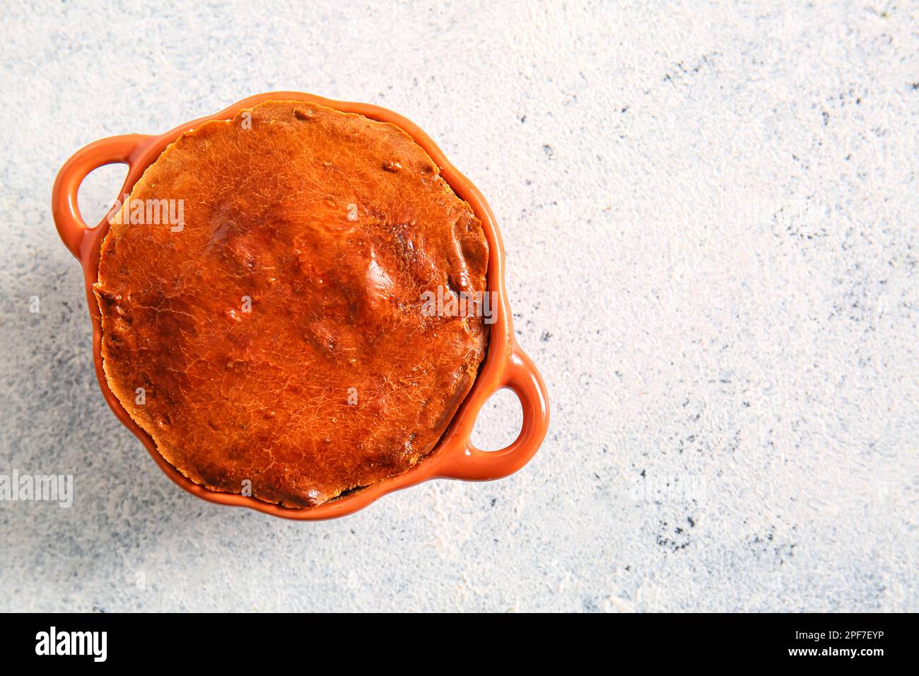 Delicious meat pie in baking form on white grunge table Stock Photo - Alamy