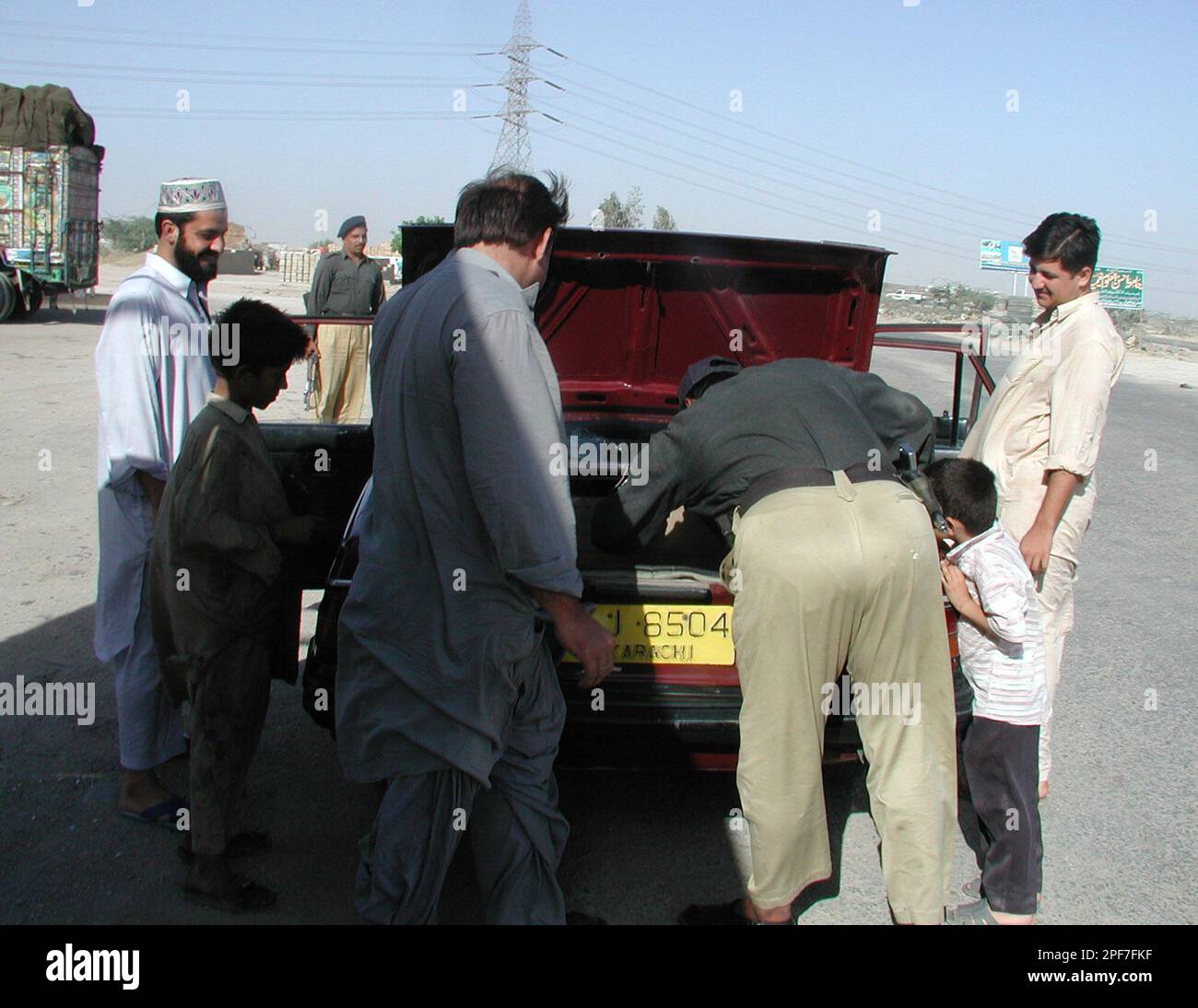 Pakistani Police Officer checks vehicle at the check post where one of ...