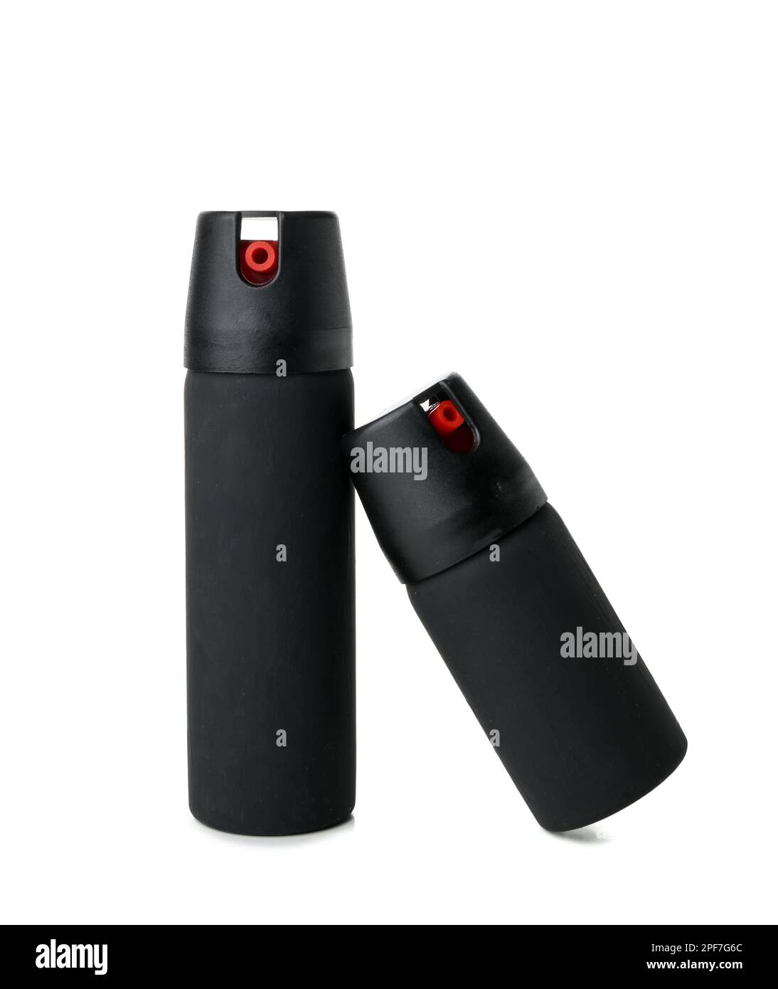 Pepper sprays on white background Stock Photo - Alamy