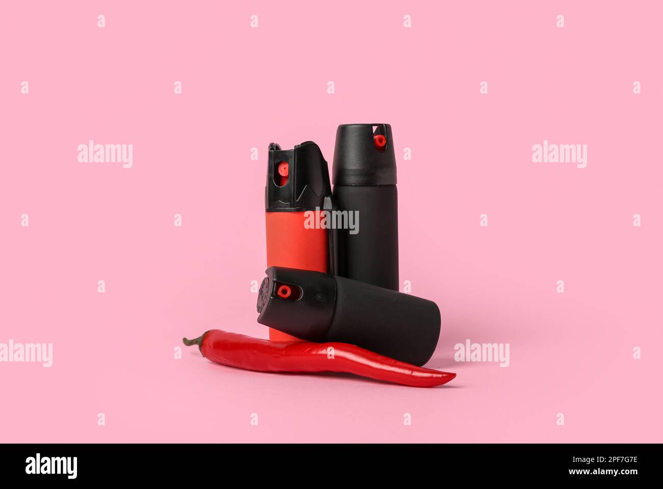 Sprays with chili pepper on pink background Stock Photo - Alamy