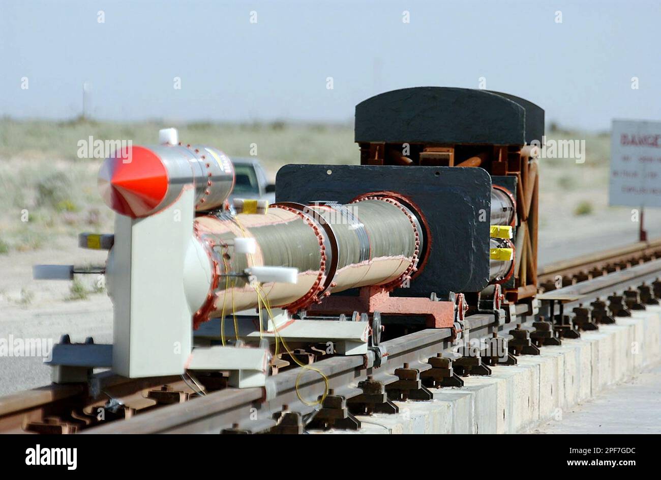 A four-stage rocket sled sits on the Holloman High Speed Test Track ...
