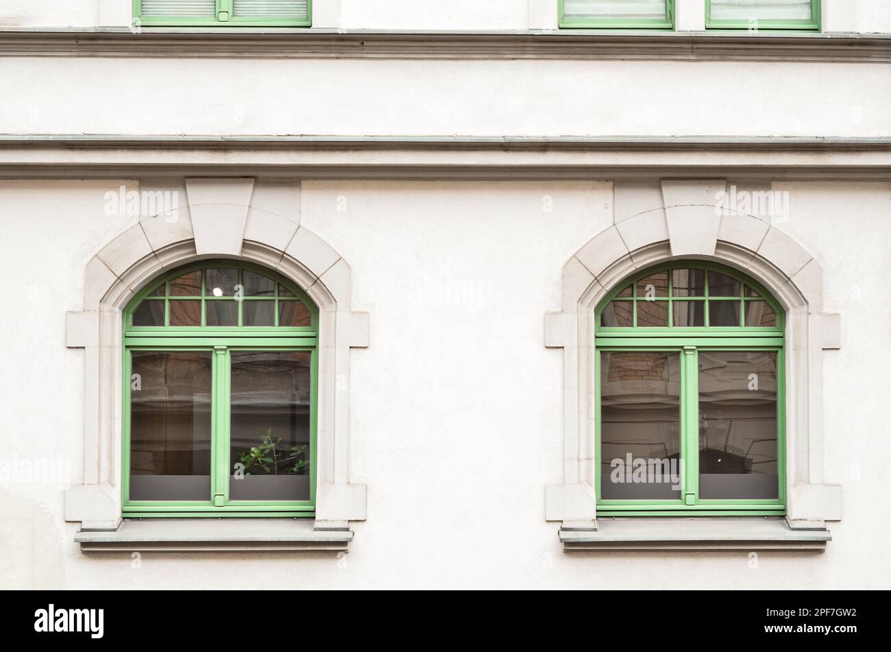 View of beautiful building with green windows Stock Photo - Alamy
