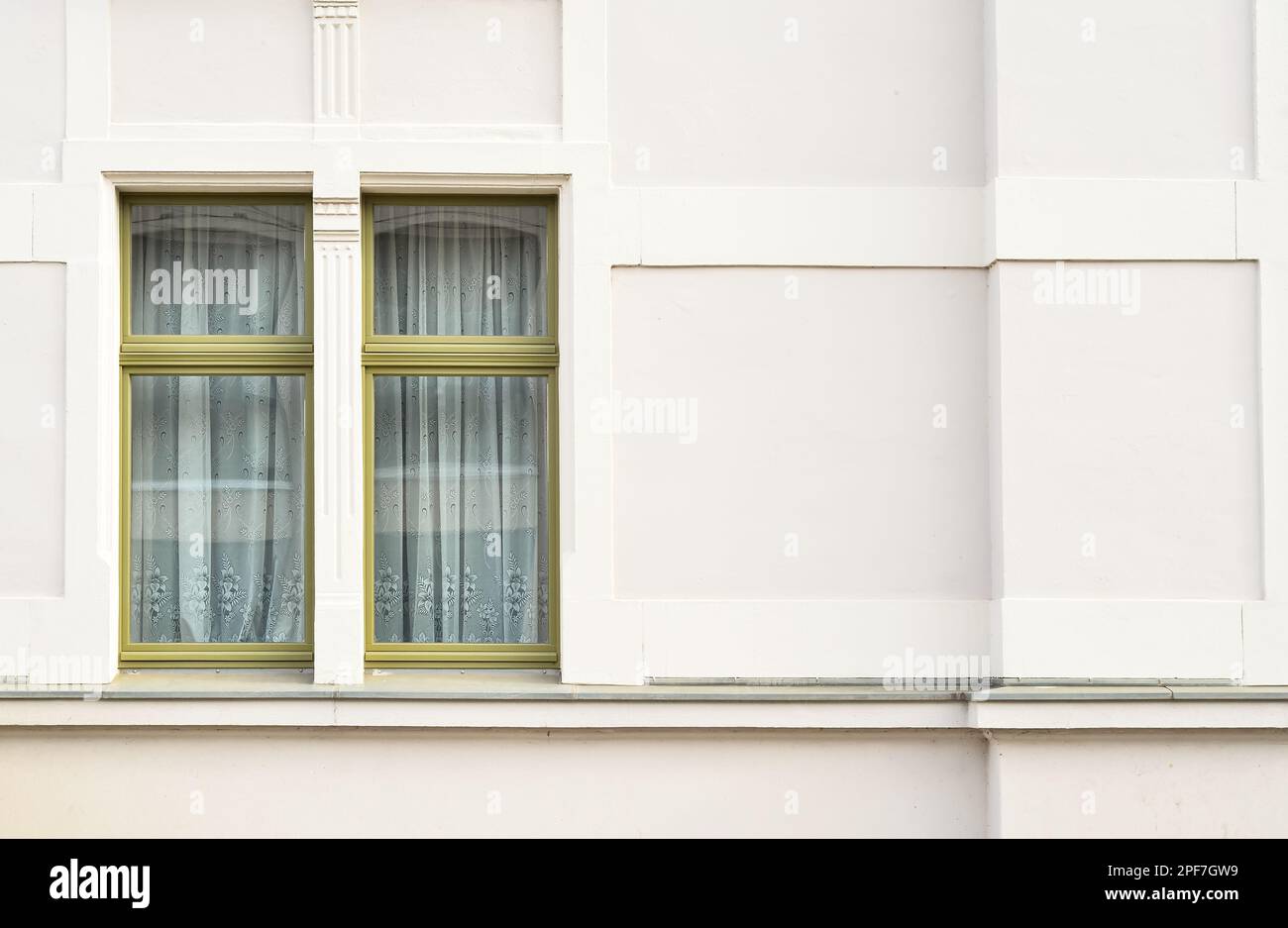 View of white building with windows Stock Photo - Alamy