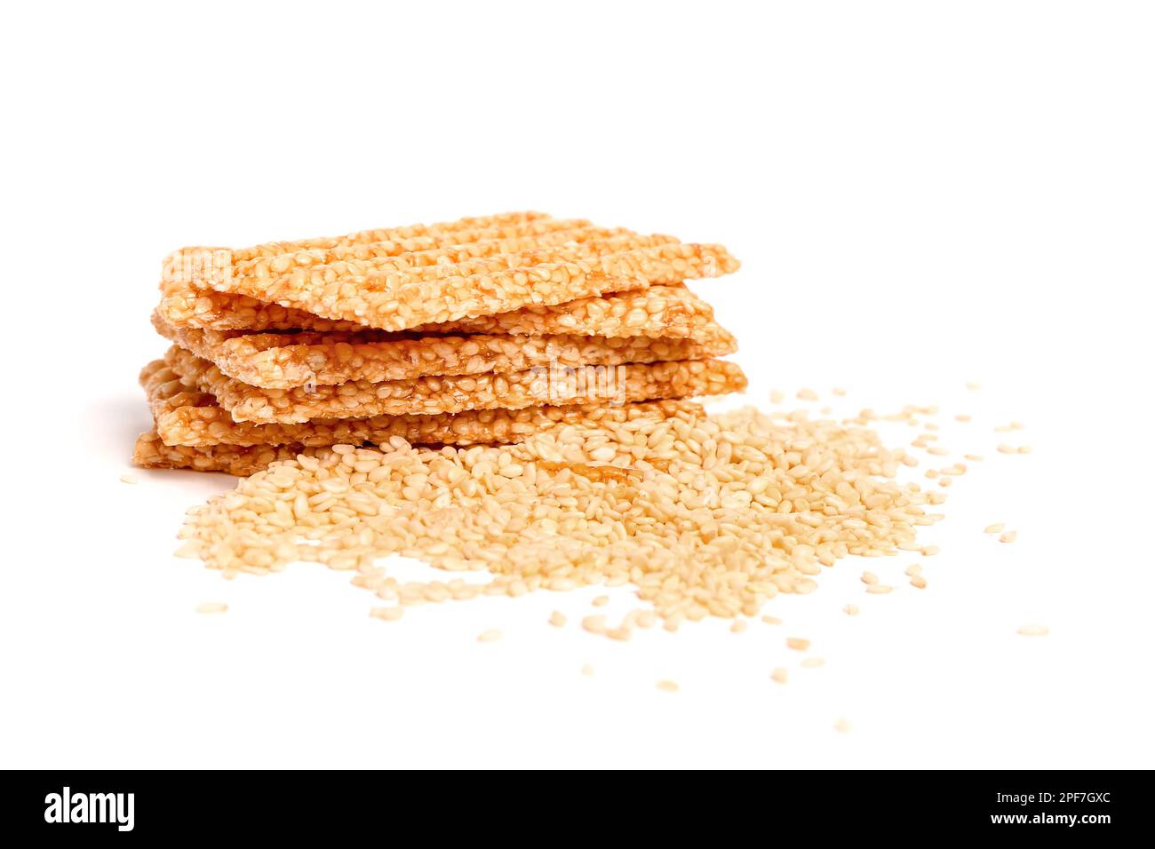 Stack of tasty kozinaki and sesame seeds on white background Stock ...