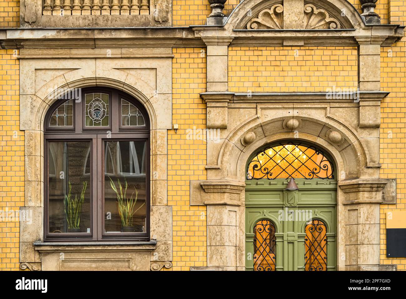 View of brick building with wooden window and door Stock Photo - Alamy