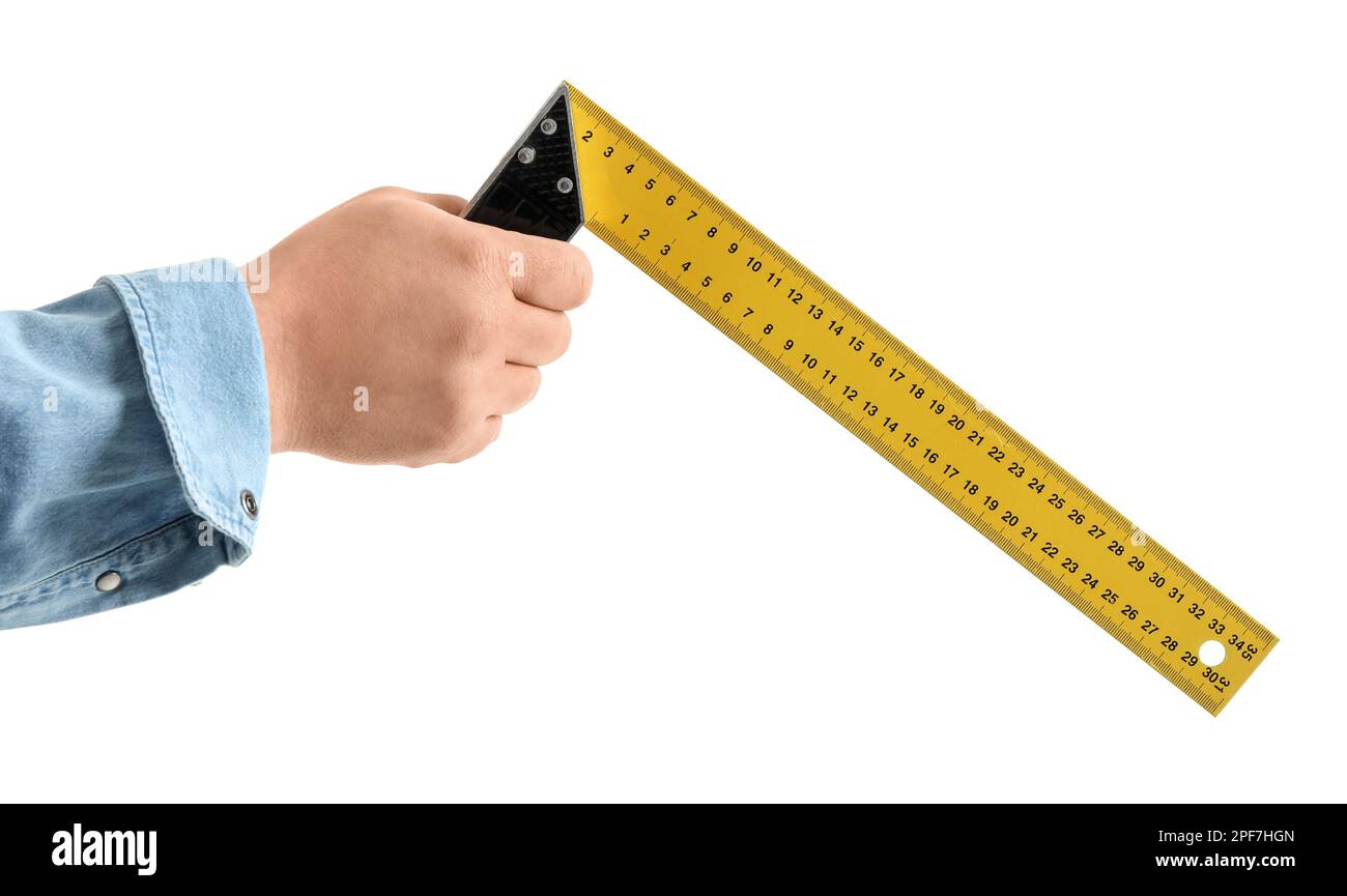 Worker with ruler on white background Stock Photo - Alamy