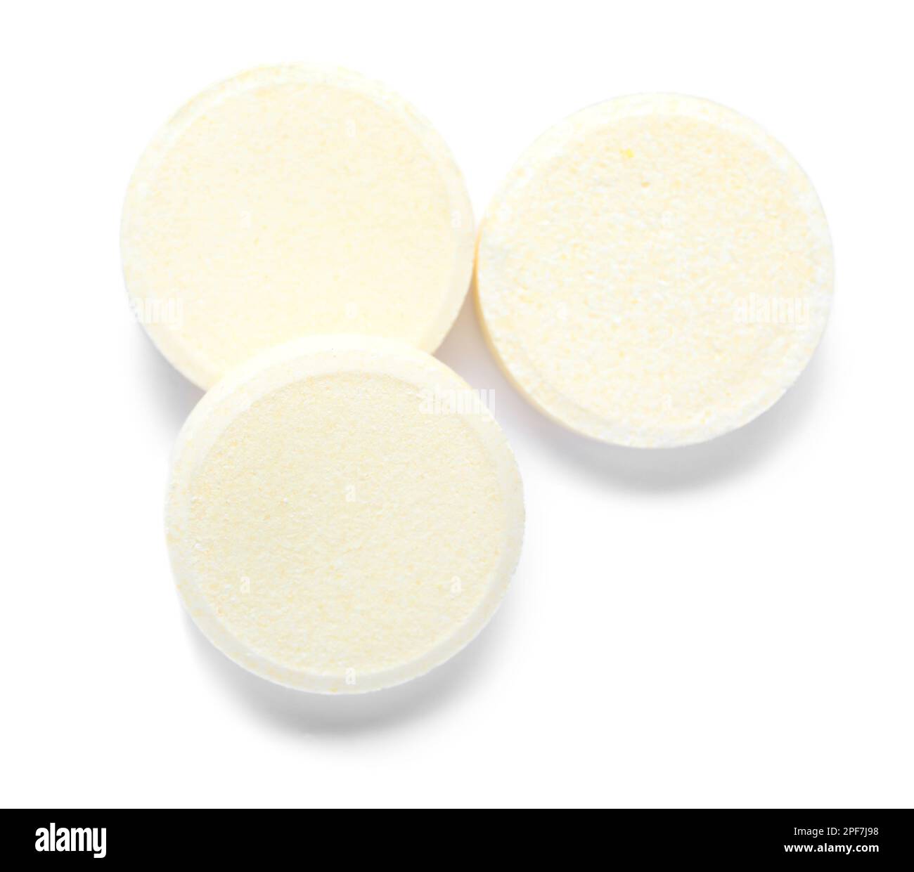 Yellow soluble tablets isolated on white background Stock Photo - Alamy