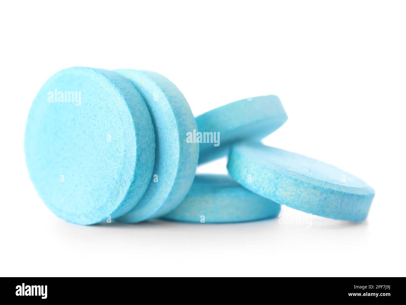 Blue soluble tablets isolated on white background Stock Photo - Alamy