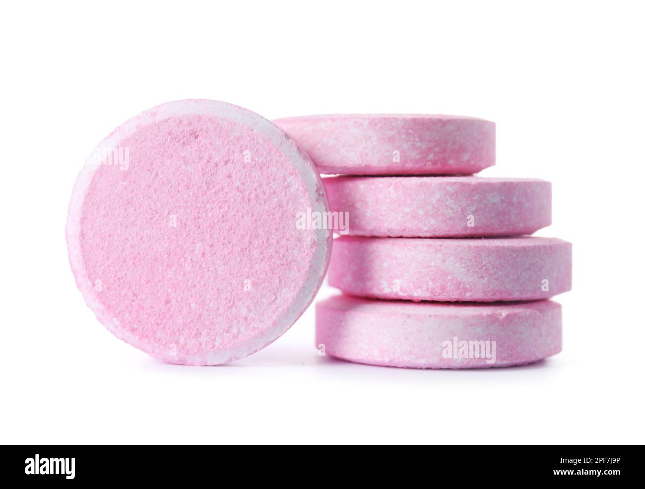 Stack of pink soluble tablets isolated on white background Stock Photo ...