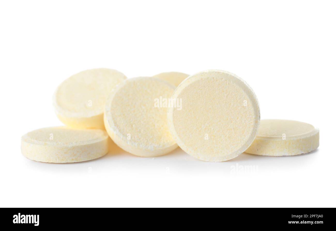 Yellow soluble tablets isolated on white background Stock Photo - Alamy