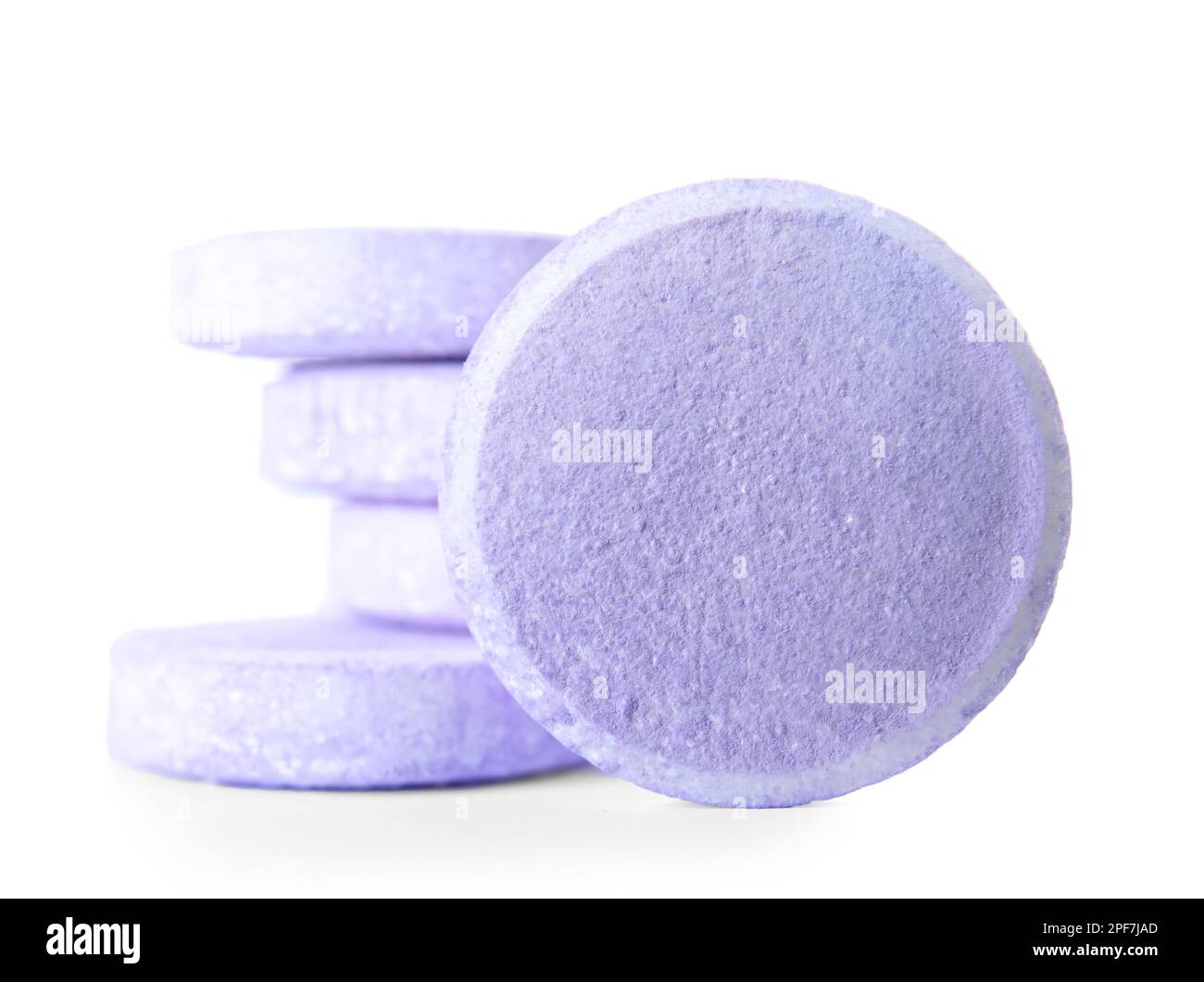 Lilac soluble tablets isolated on white background Stock Photo - Alamy