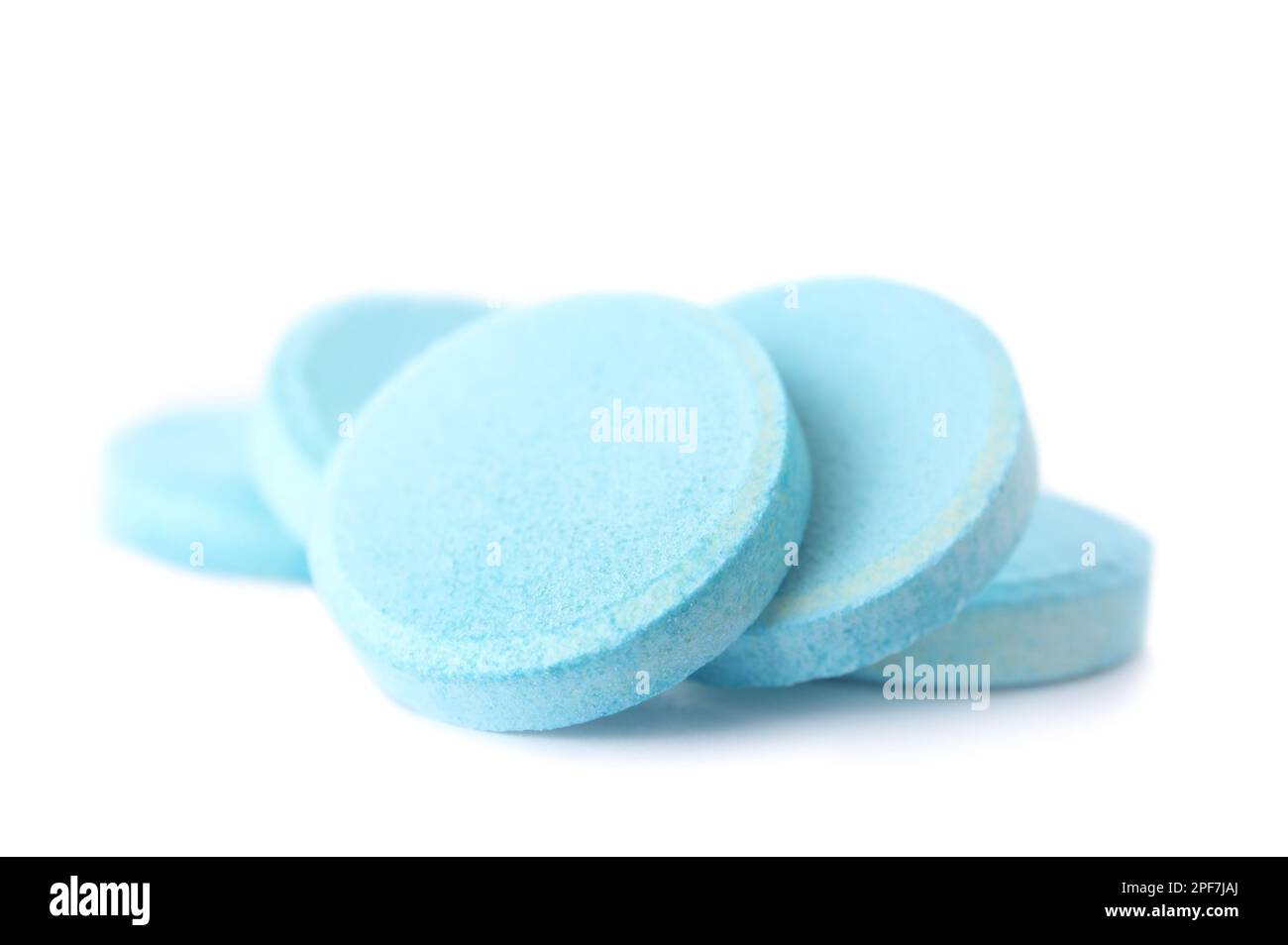 Blue soluble tablets isolated on white background Stock Photo - Alamy