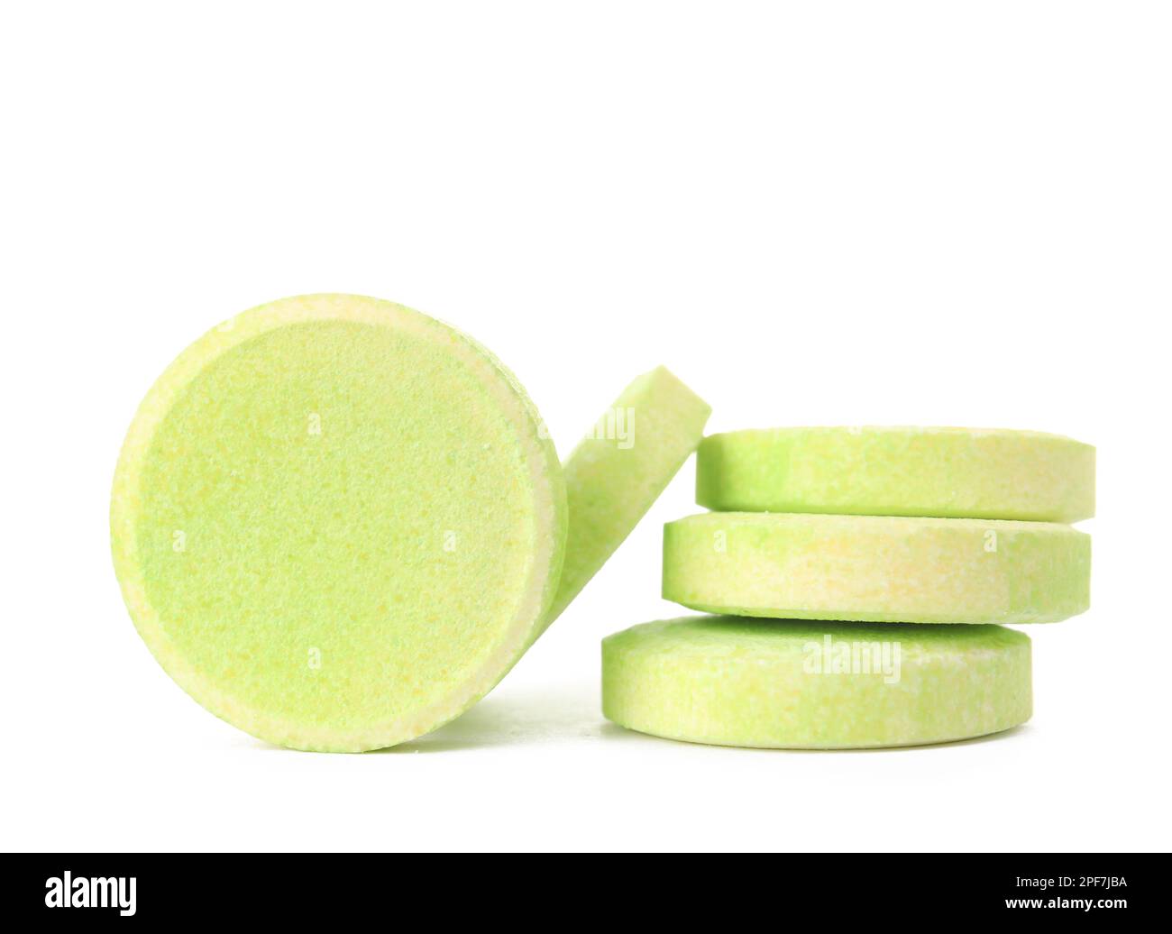Green soluble tablets isolated on white background Stock Photo - Alamy