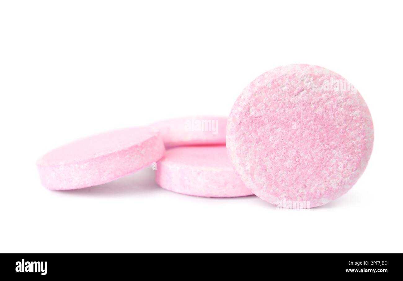 Pink soluble tablets isolated on white background Stock Photo - Alamy