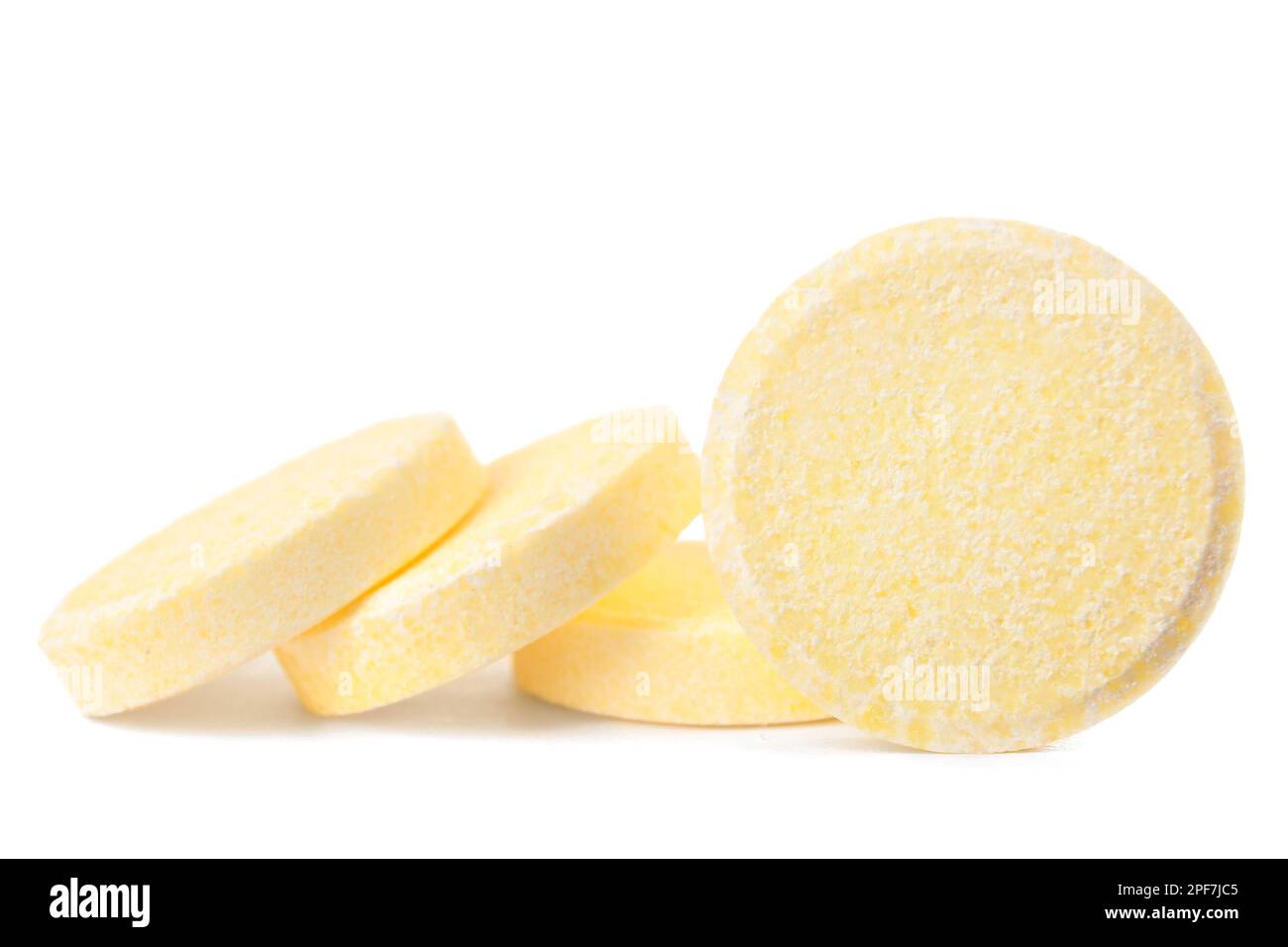 Yellow soluble tablets isolated on white background Stock Photo - Alamy