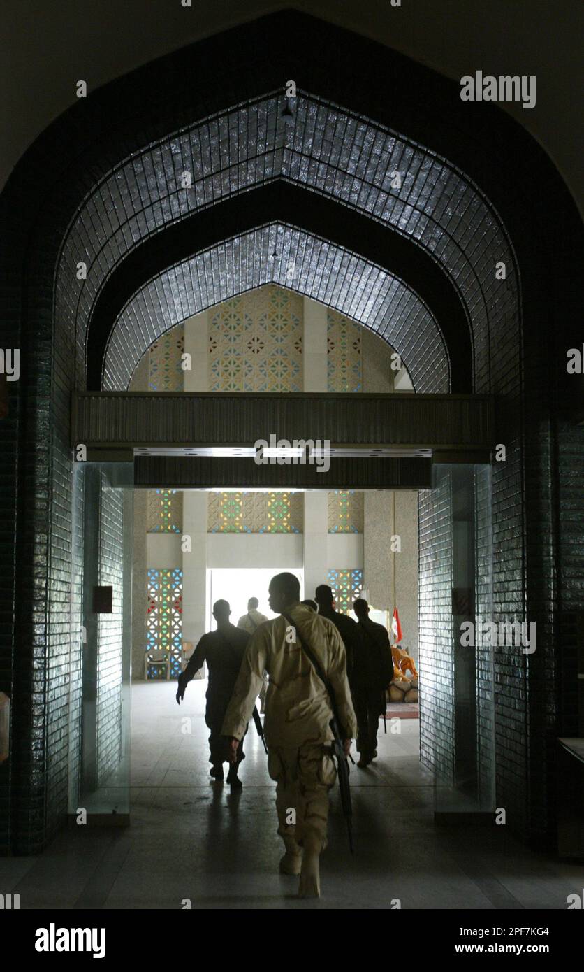 U.S. soldiers from Task Force 1-64 of the 3rd Infantry Division walk ...