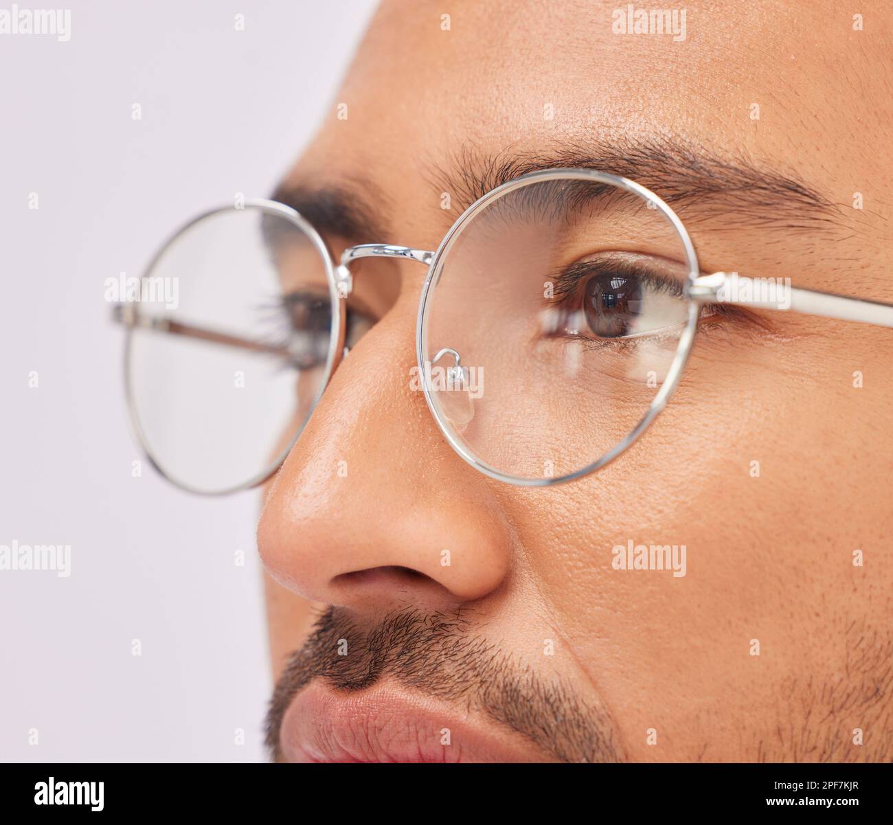 Zoom, optometry and face of a man with glasses for vision, intelligence ...