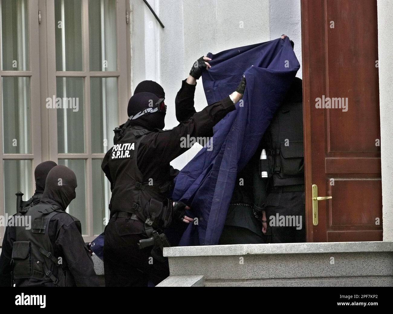 Romanian special police soldiers escort Greece's most wanted criminal ...