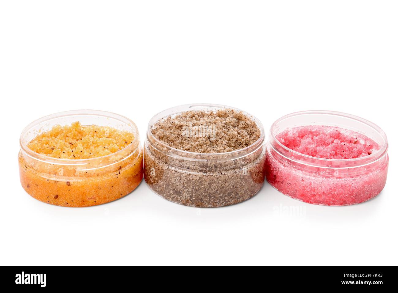 Jars of natural body scrub on white background Stock Photo - Alamy