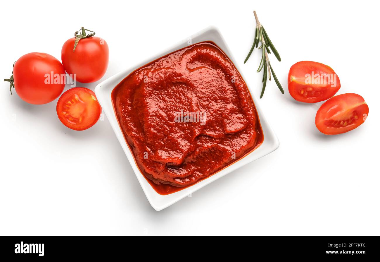 Bowl of tasty tomato paste isolated on white background Stock Photo - Alamy