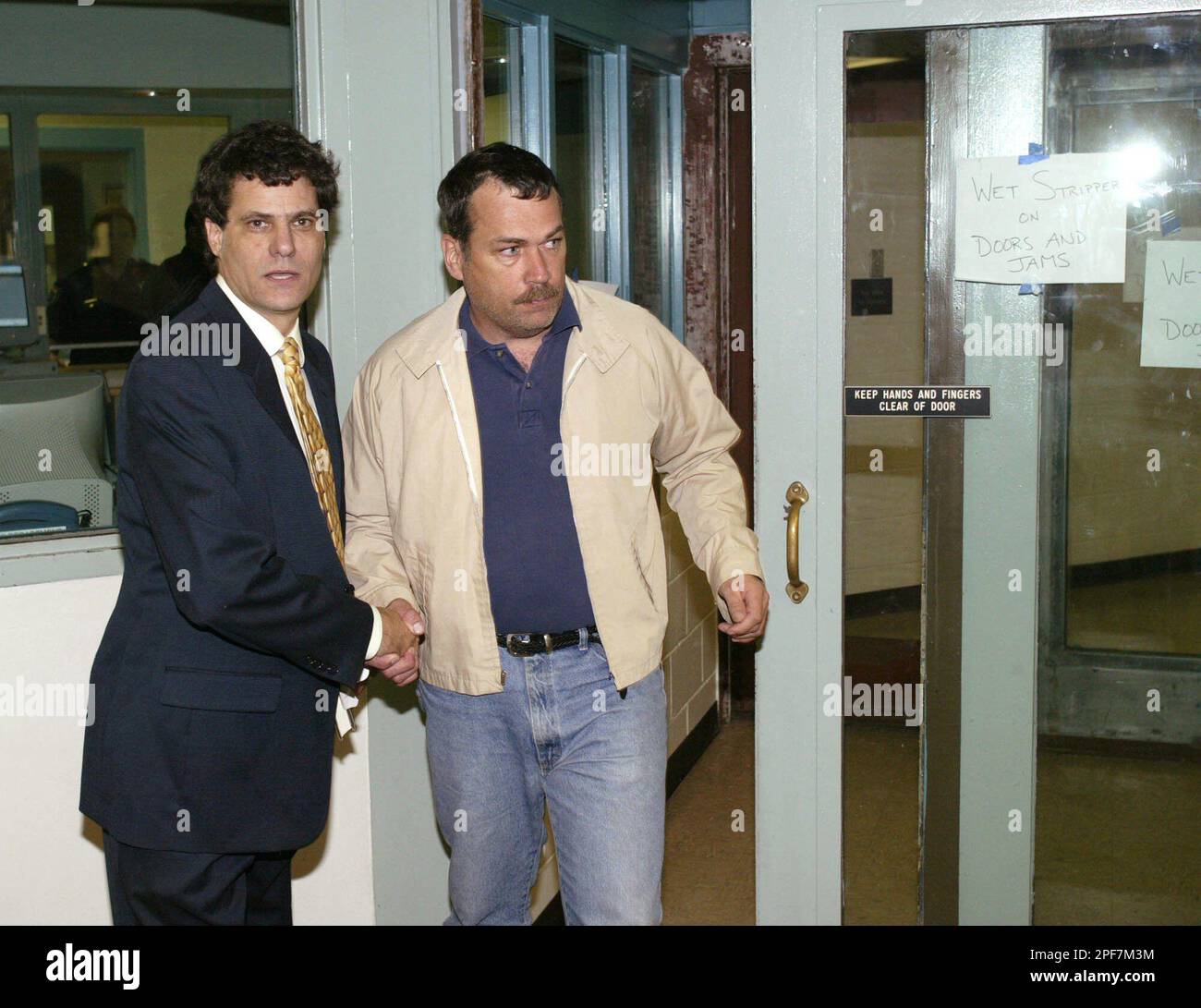 Kennedy Space Center employee Michael Pankiewicz, 44, right, is greeted ...