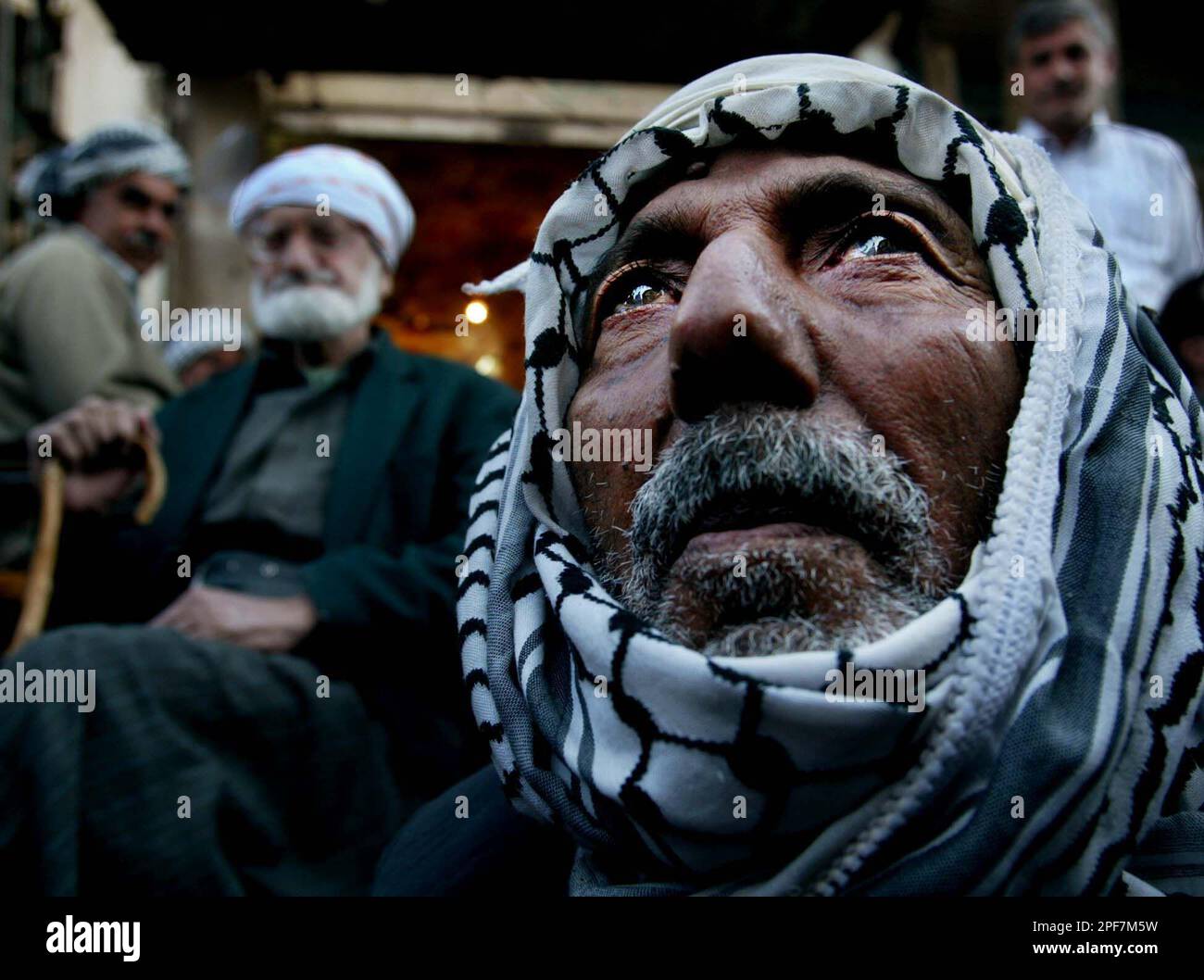 Iraqi men sit outside a teahouse in the Turkish quarter in Kirkuk, Iraq ...