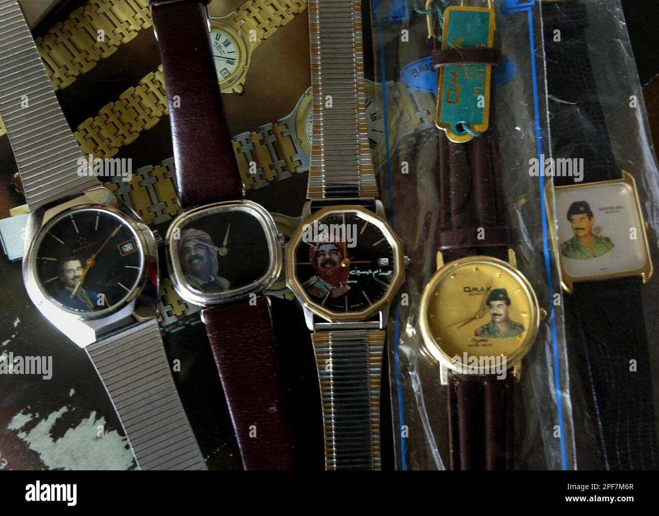 A selection of watches adorned with a portrait of Saddam Hussein is ...