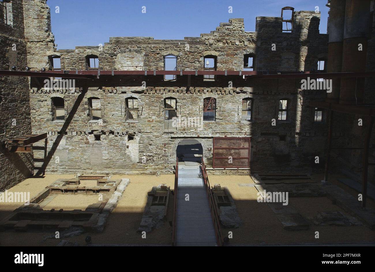 Damage from a fire in 1991 can be seen in the walls of the courtyard of ...