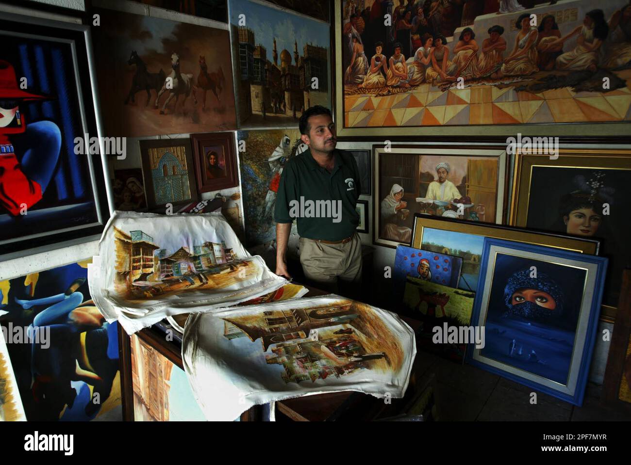 Iraqi artist Mohammed Al Hamdani waits for customer in his gallery-shop ...