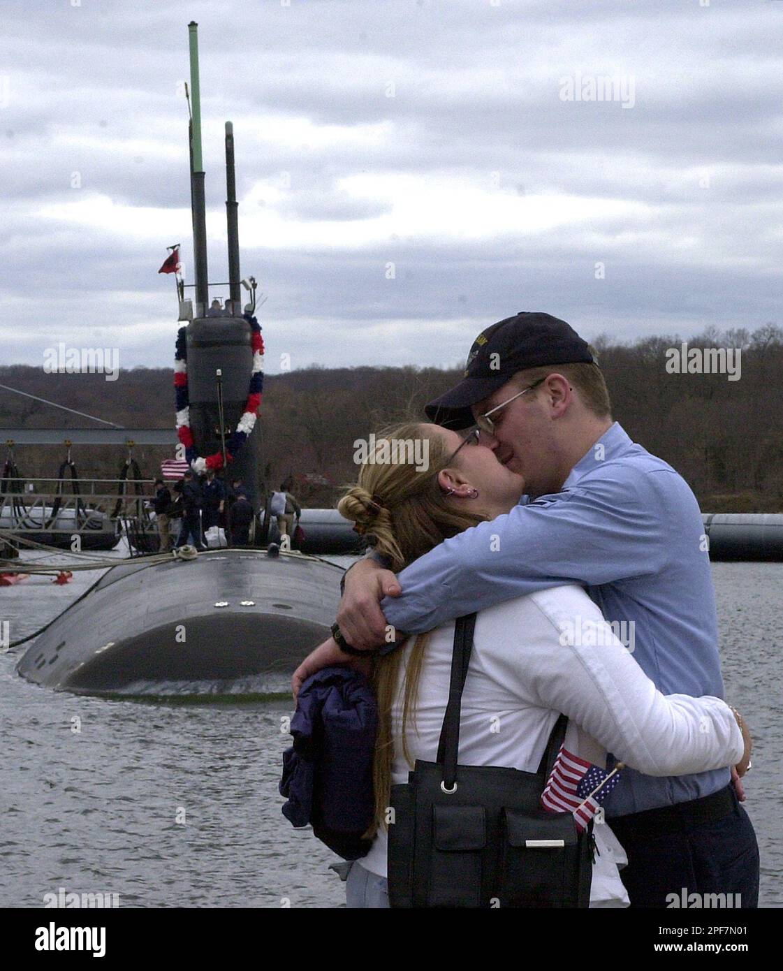 Machinist's Mate 2nd Class Steven Kester and his wife, Tiffany, share a ...