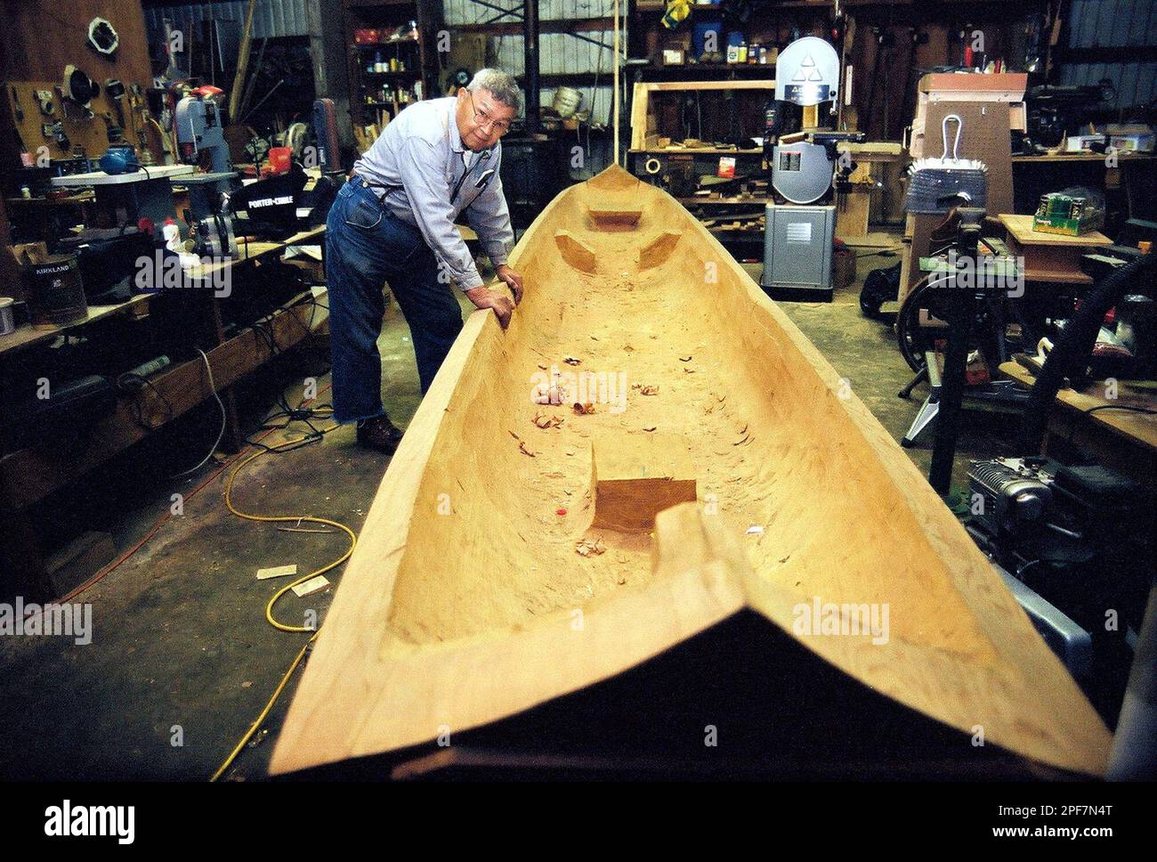 Glenn Moore stands, March 12, 2003, with the traditional dugout canoe ...
