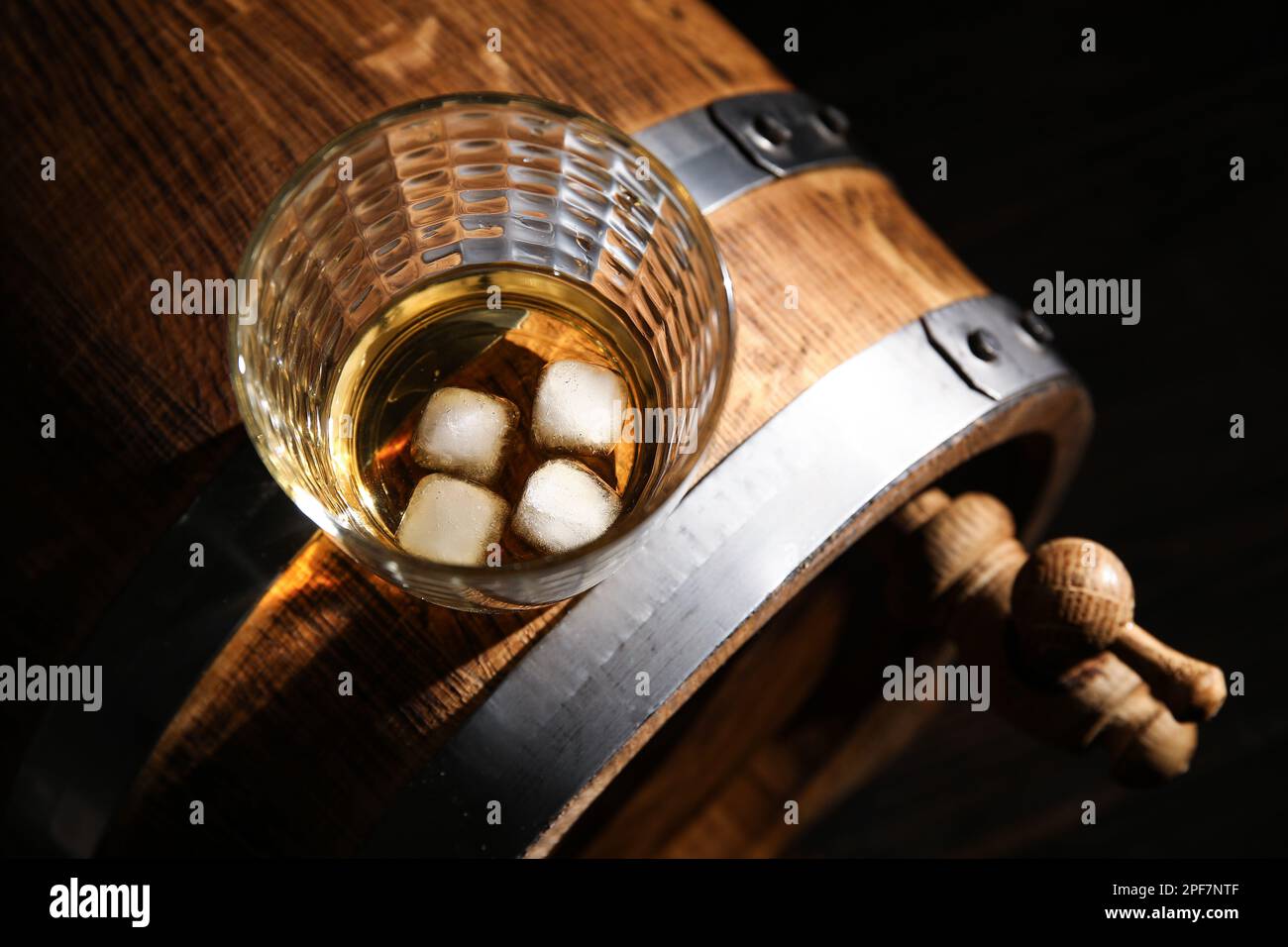 Oak barrel with glass of cold whiskey on dark background Stock Photo ...
