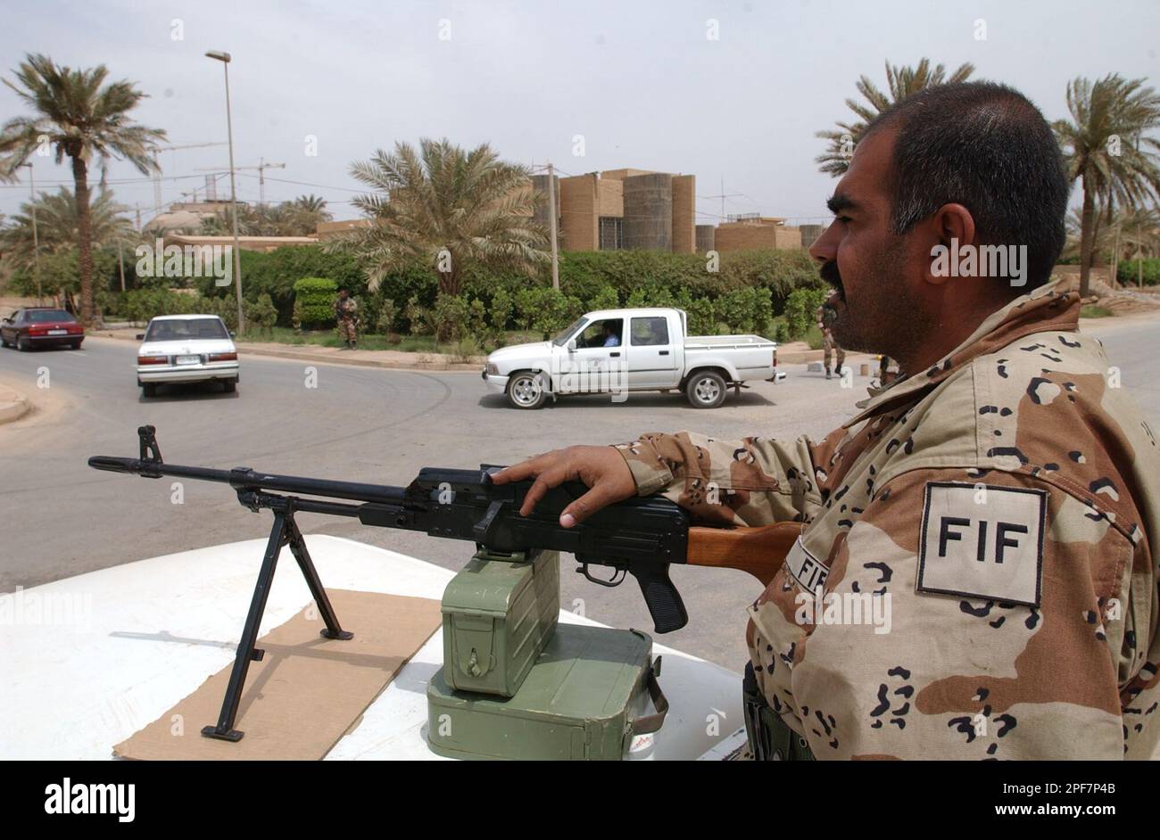 An Iraqi FIF (Freedom Iraqi Forces) soldier stands guard during a ...