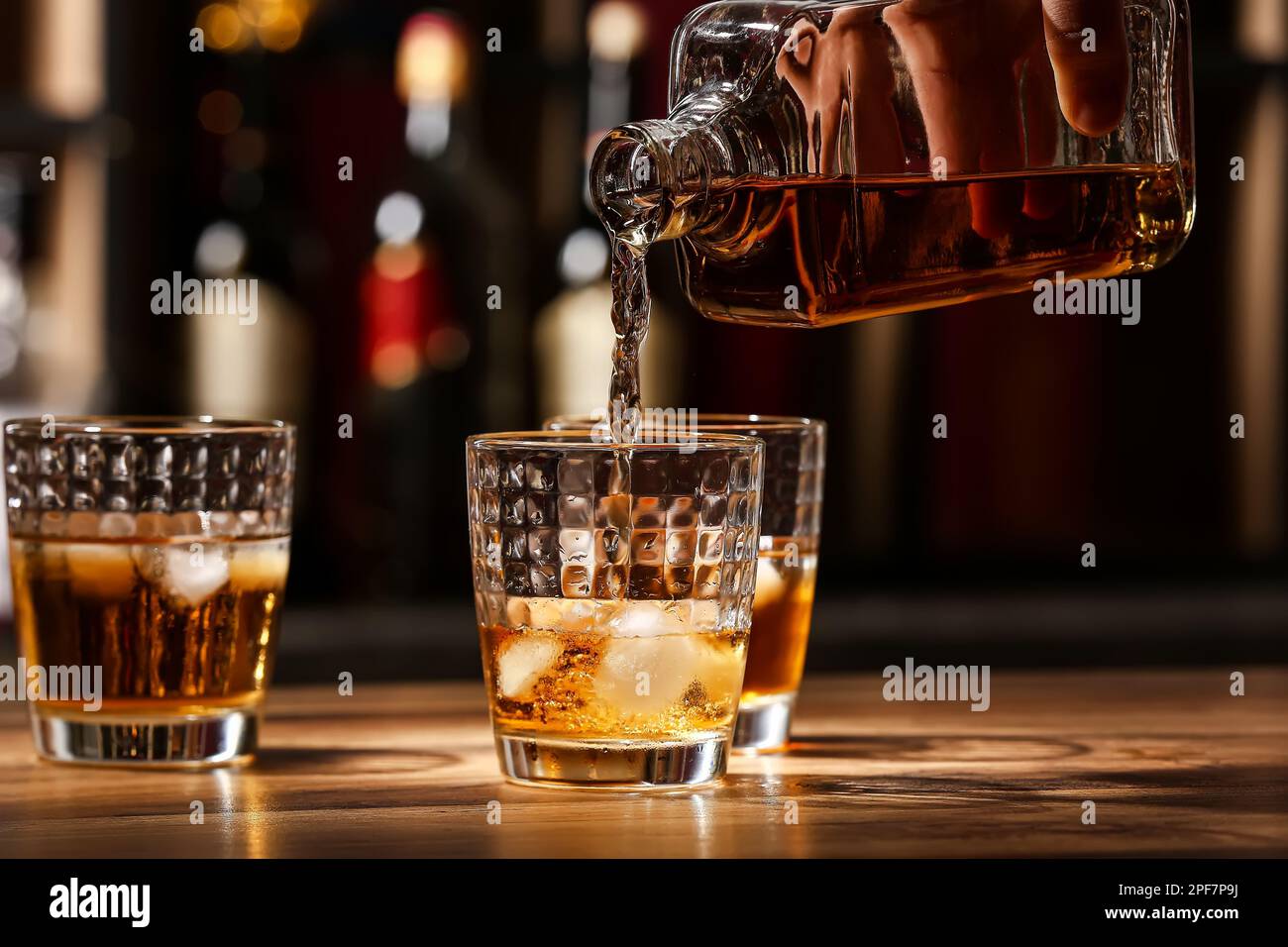 Bartender pouring whisky in hi-res stock photography and images - Alamy