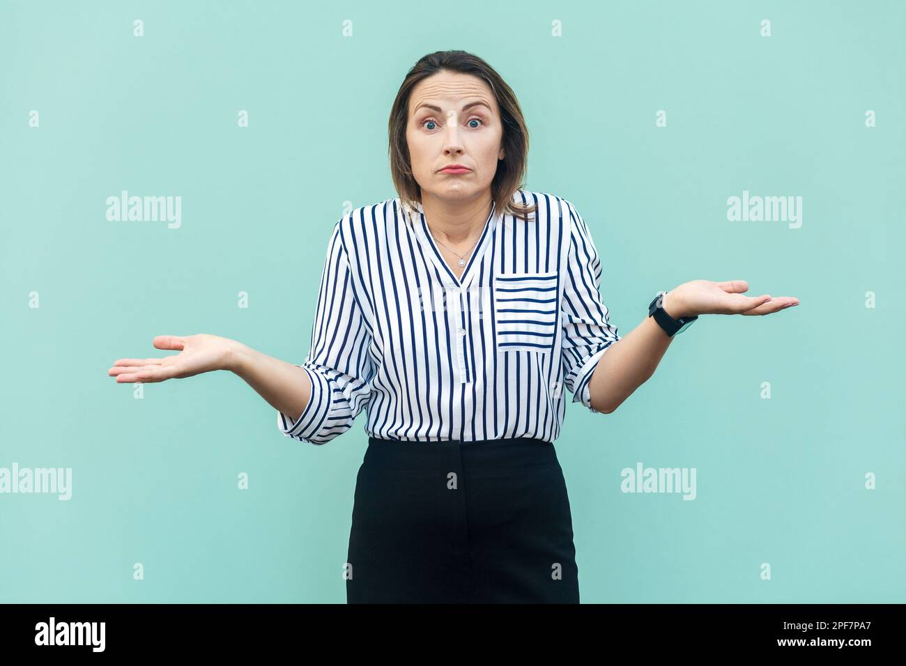 Uncertain Clueless Attractive Middle Aged Woman Wearing Striped Shirt