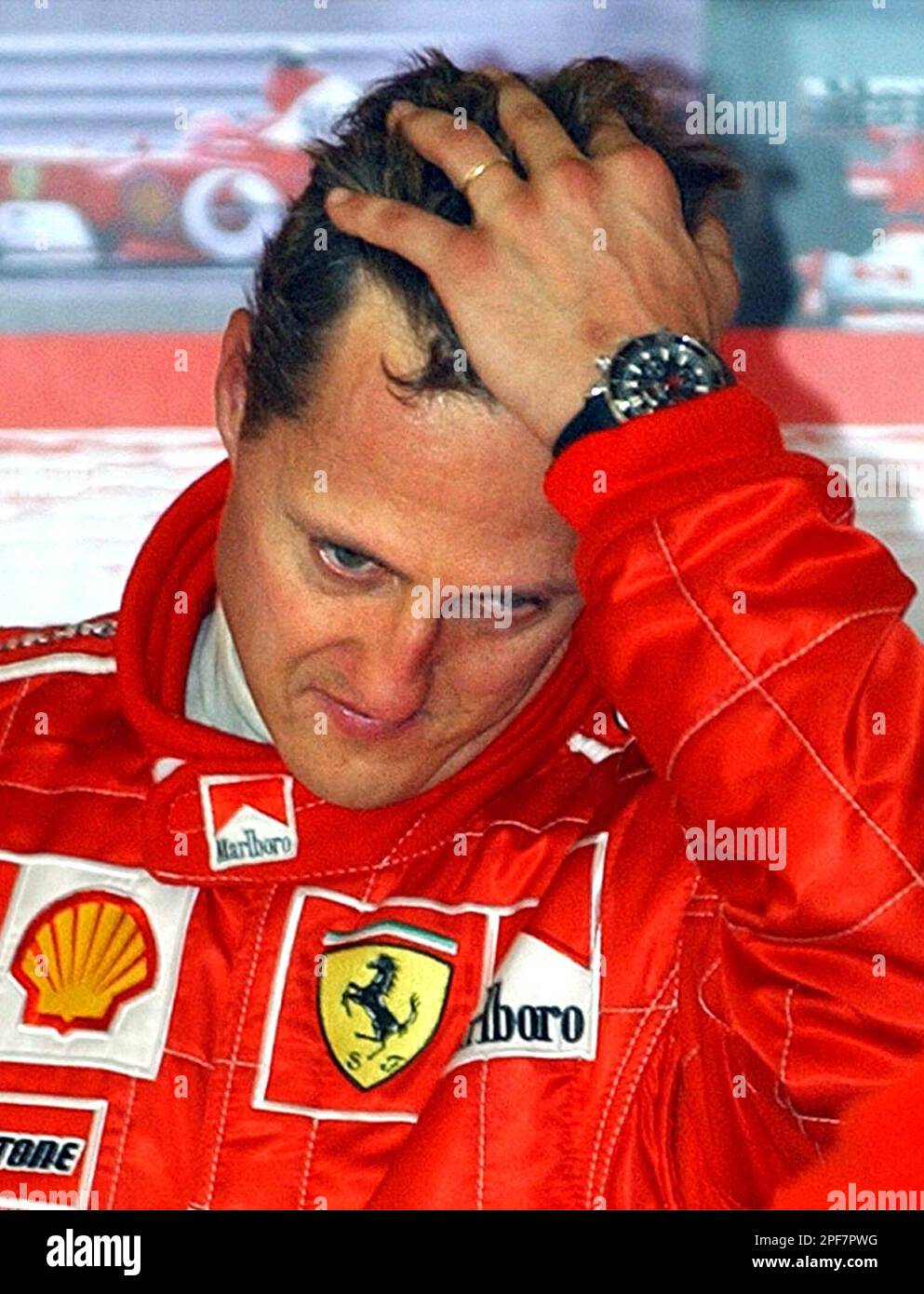 Germany's Michael Schumacher reacts at the Ferrari pits during practice ...