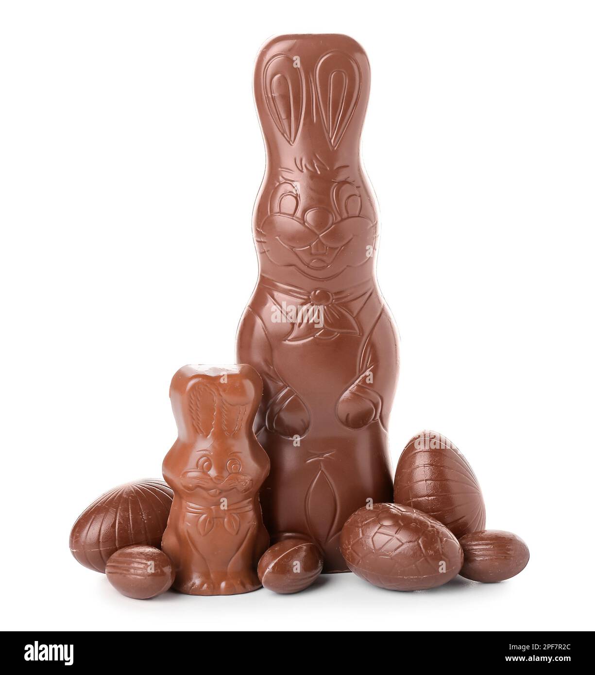 Chocolate Easter bunnies with eggs on white background Stock Photo - Alamy