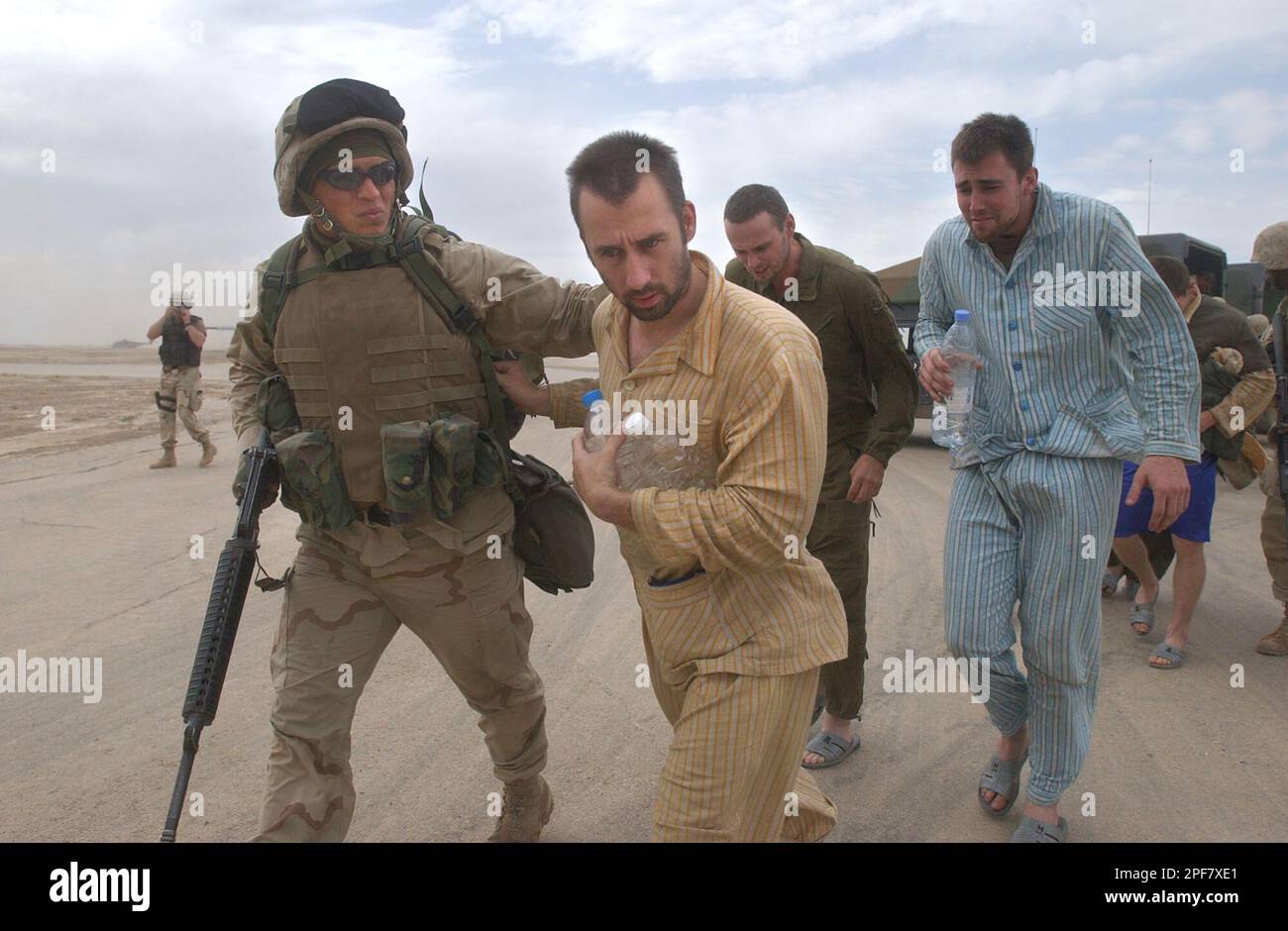 Former POWs Chief Warrant Officer David S. Williams, center, and Chief ...