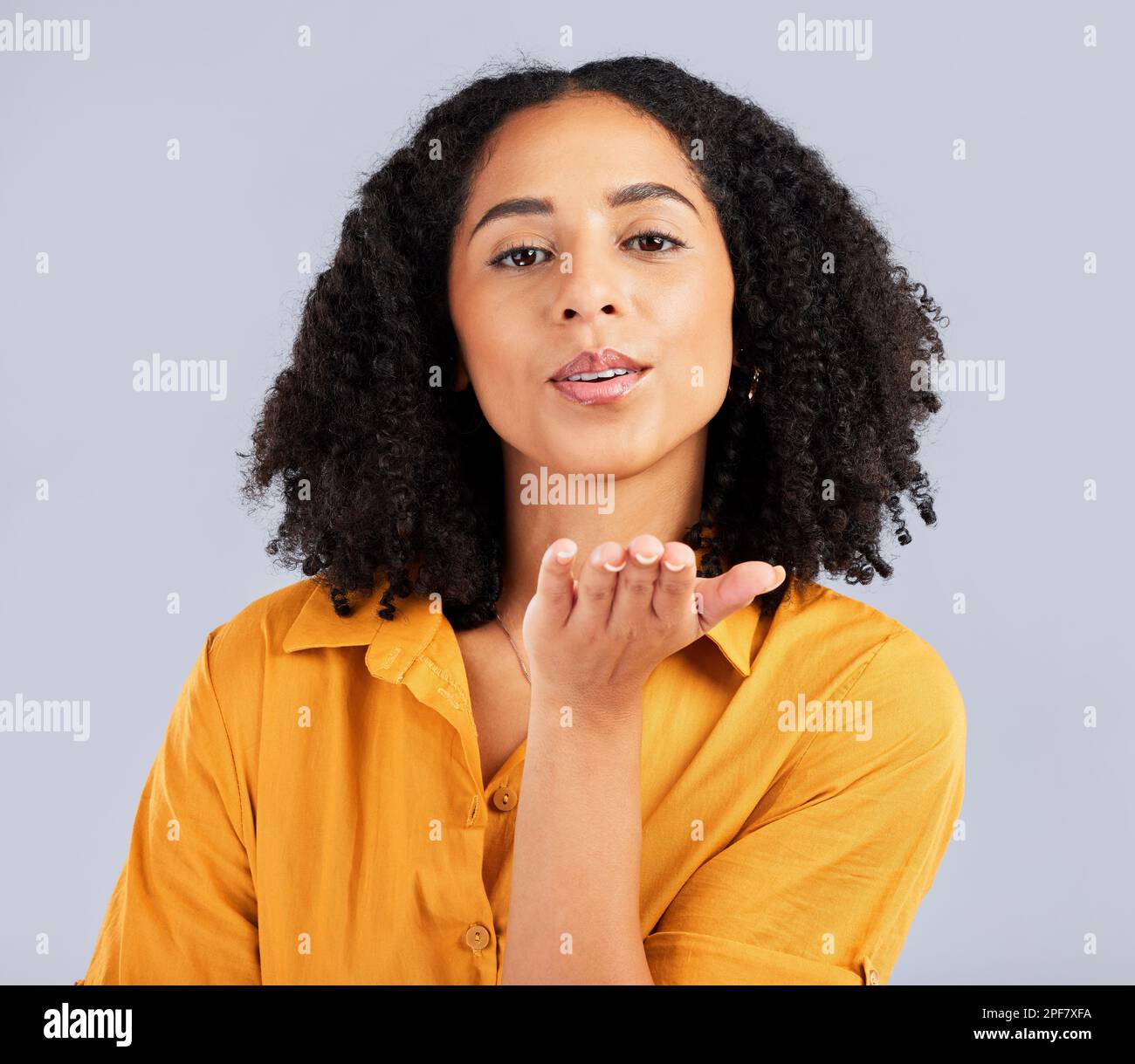 Flirty, happy and a portrait of a woman blowing kiss isolated on a ...