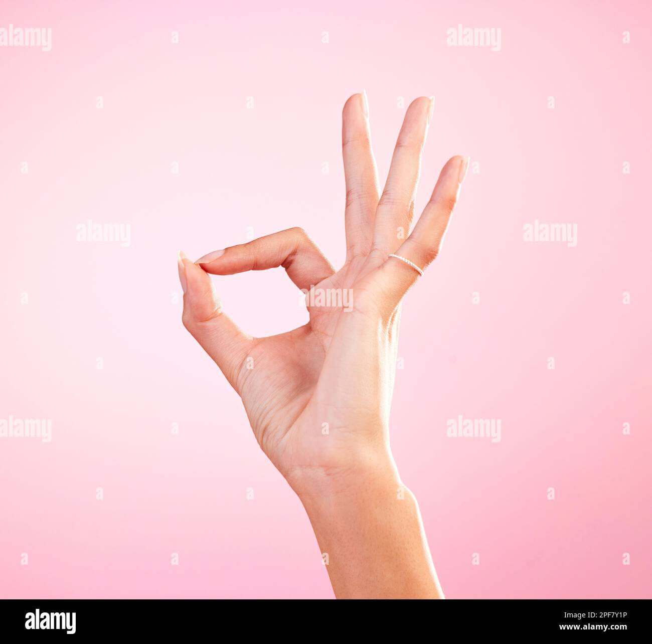 Hand, perfect and ok sign or emoji in studio for motivation, review and ...
