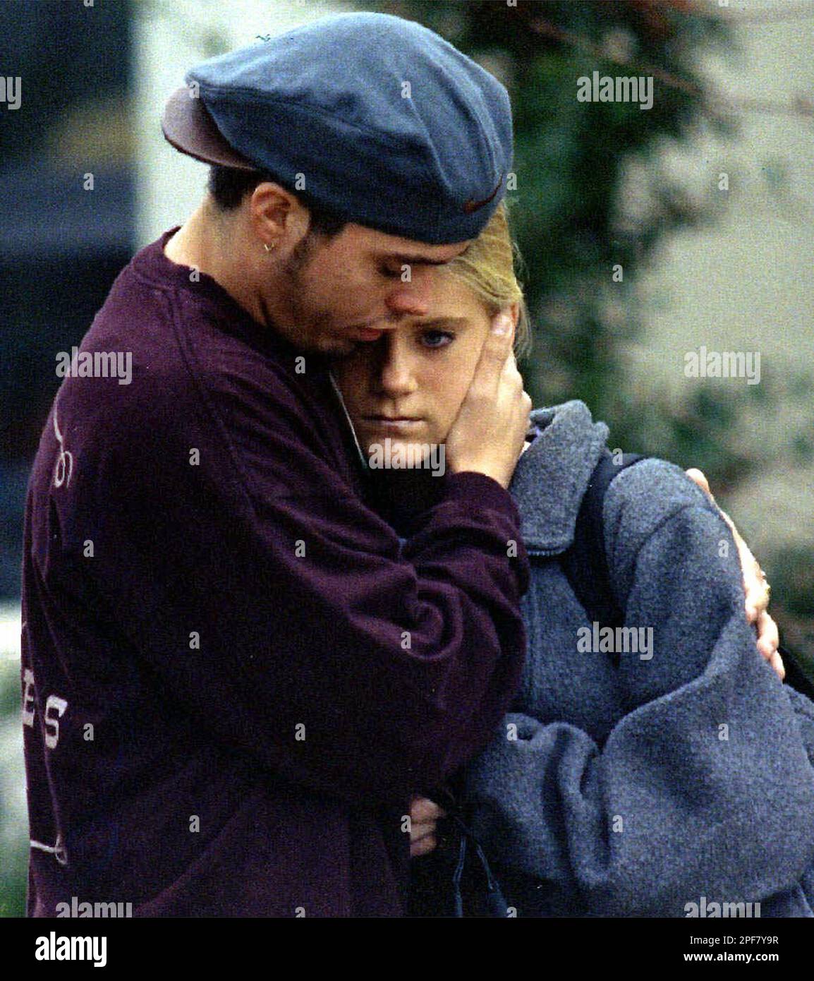Brandon Finke, left, 18, comforts Jordan Cunic, 16, after she walked ...