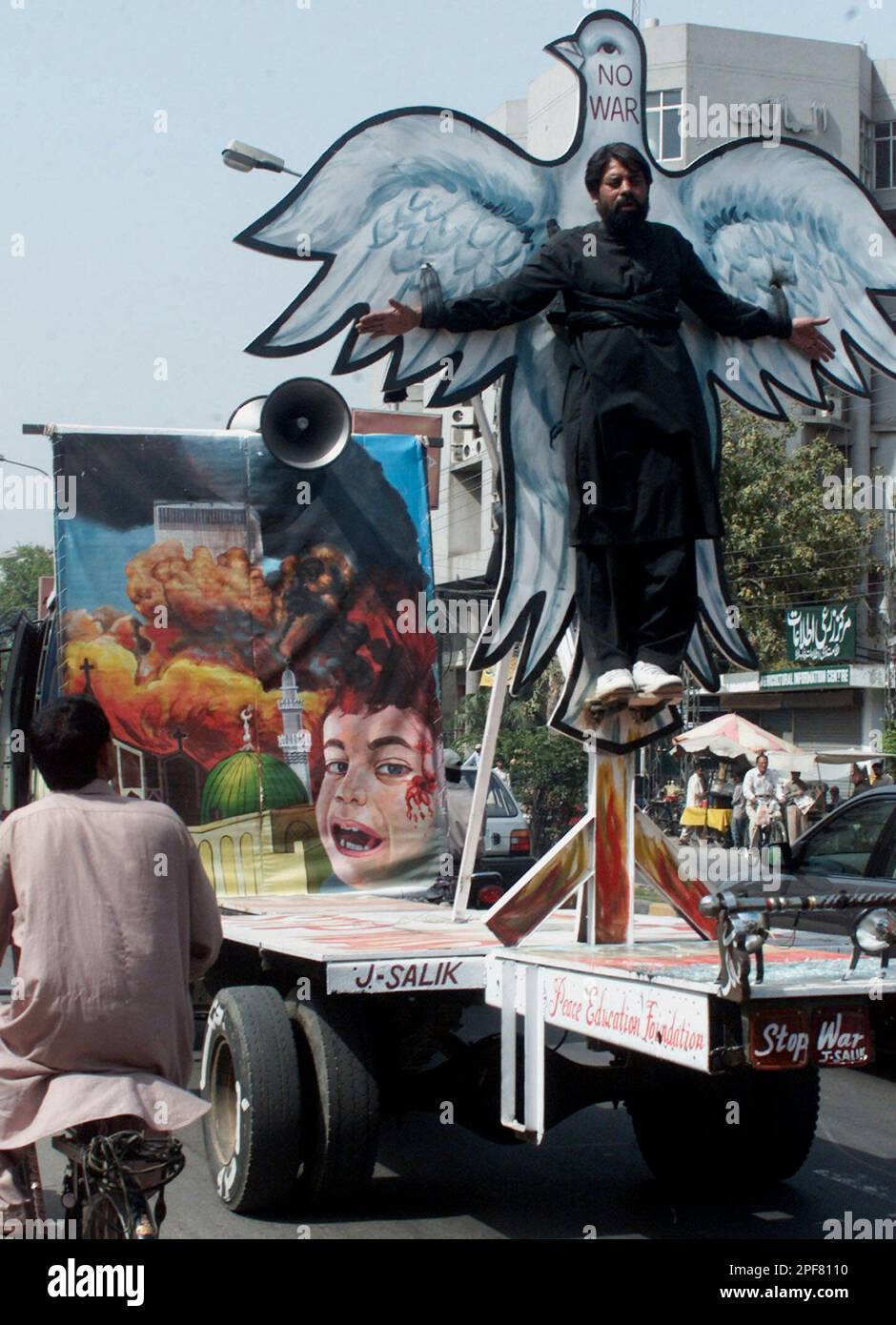 J. Salik, a Pakistani Christian leader and human rights activist, hangs ...