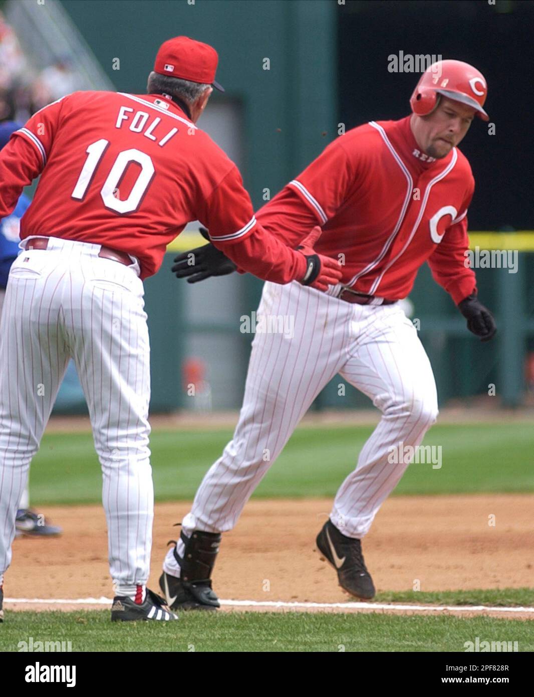 Cincinnati Reds' Sean Casey, right, is congratulated by third base ...