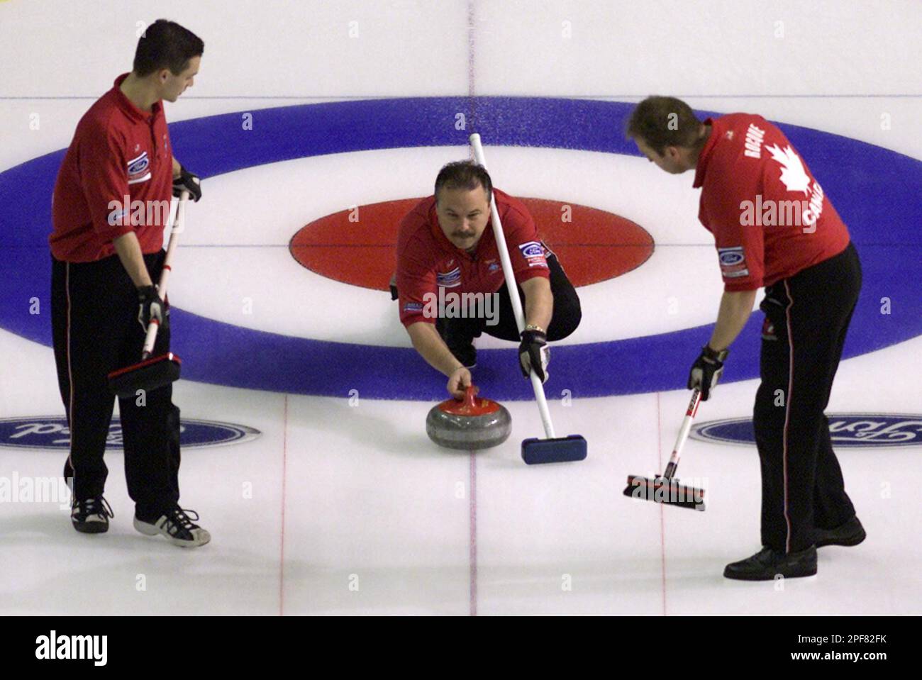 Team Canada second Scott Pfeifer (left) and lead Marcel Rocque look on ...
