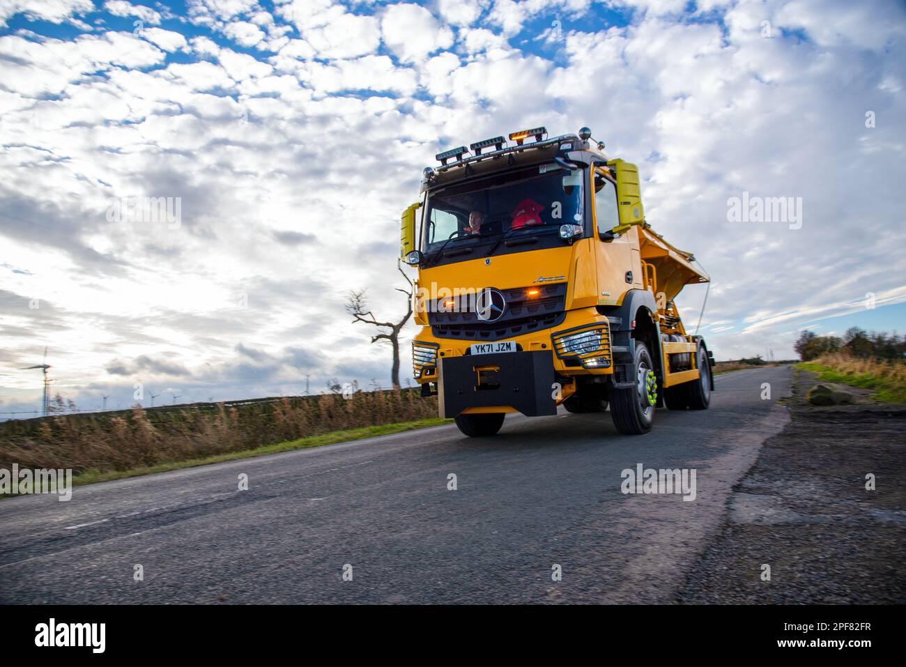 Mercedes Benz Arocs gritter truck operating on the roads of West ...